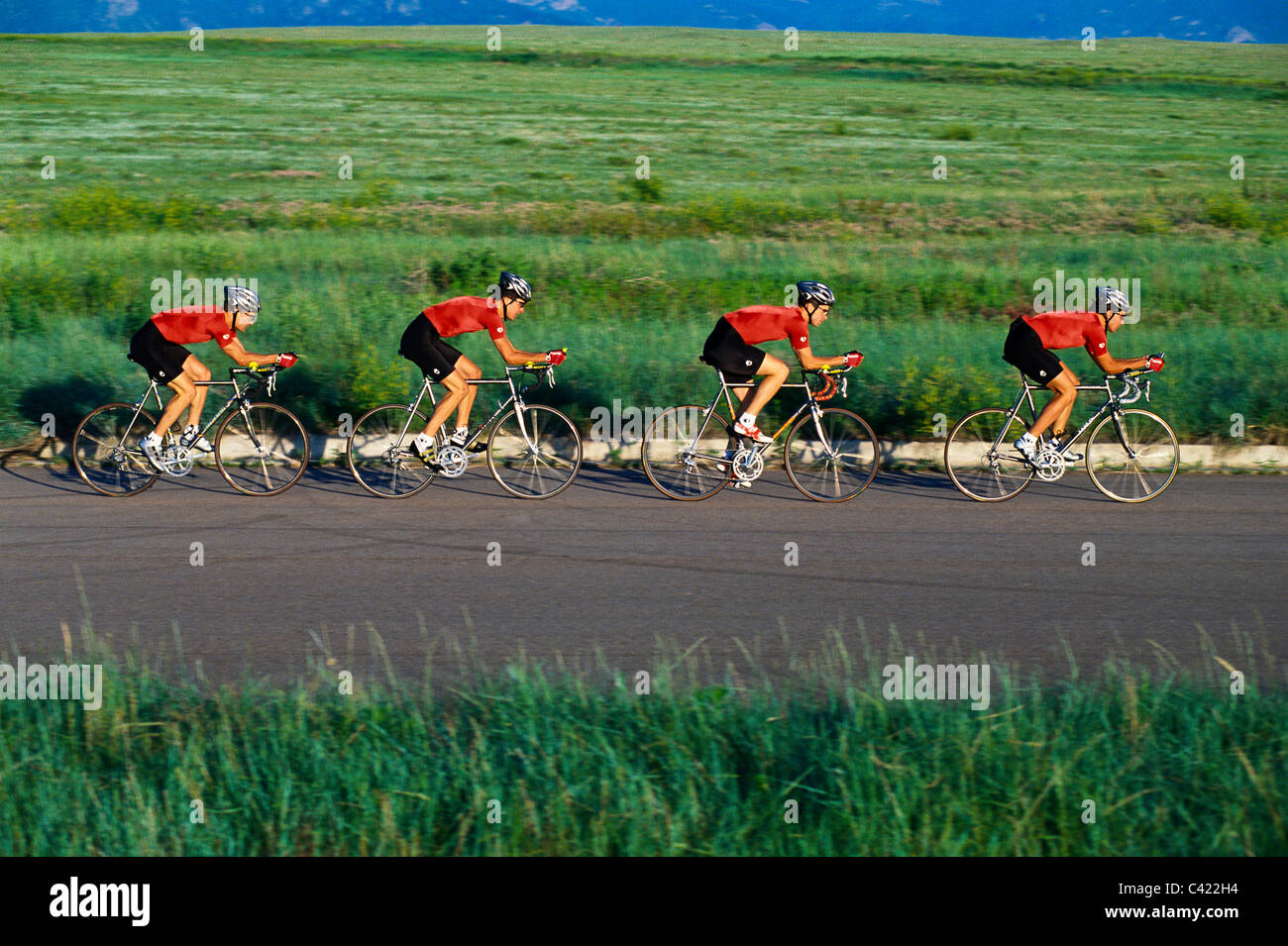 Road cycling team in action Stock Photo - Alamy