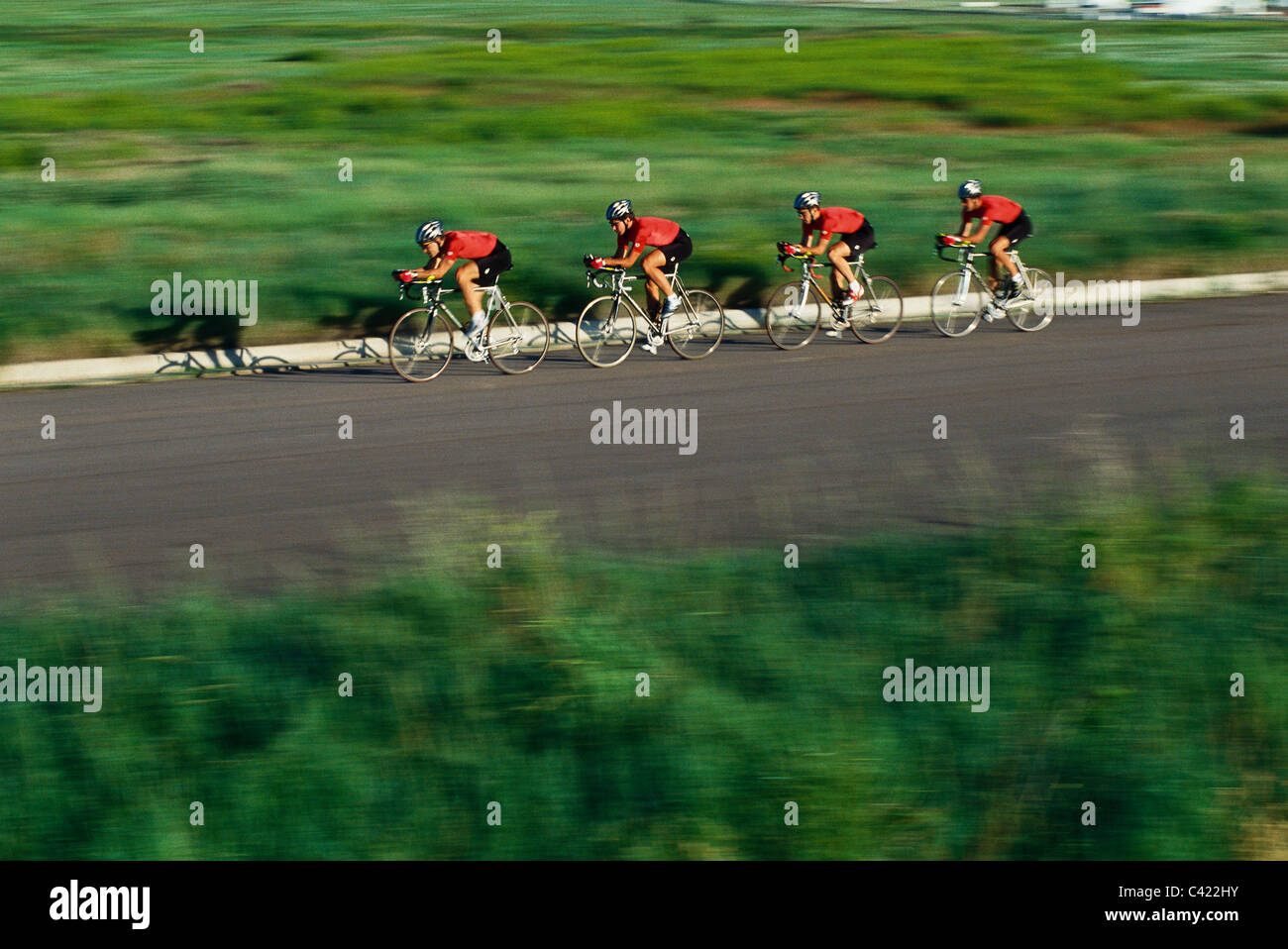 Road cycling team in action Stock Photo - Alamy