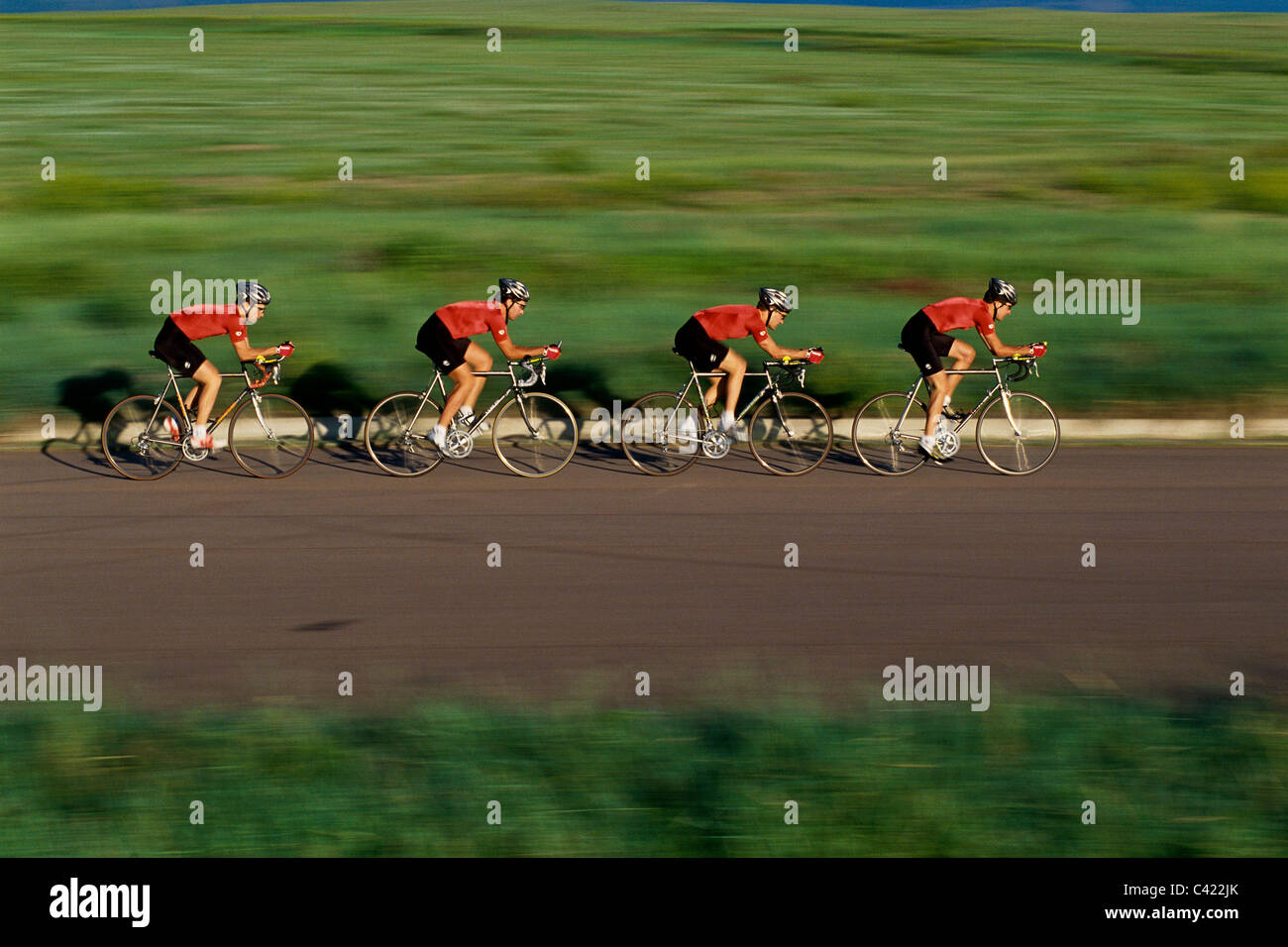 Road cycling team in action Stock Photo - Alamy