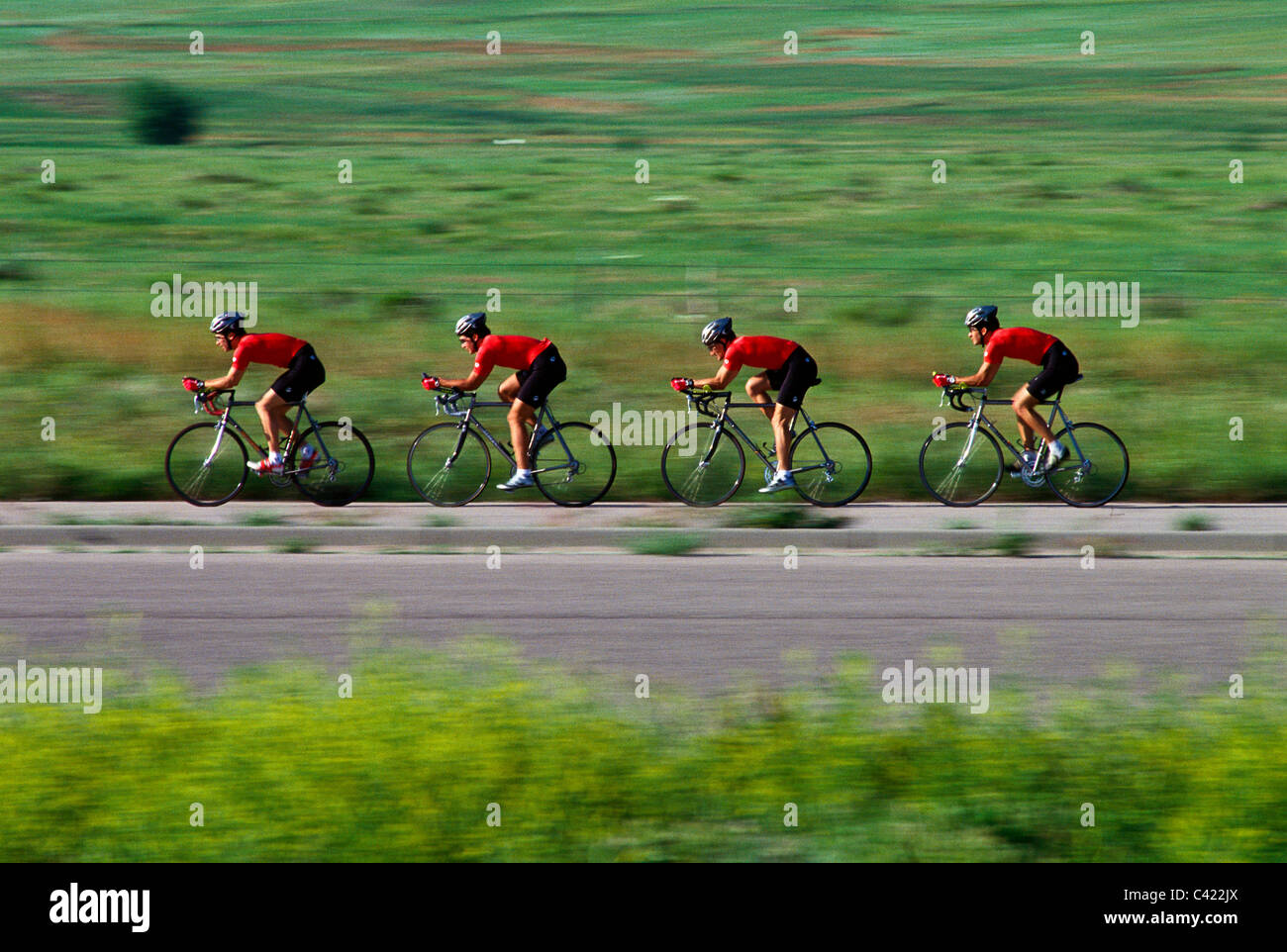 Road cycling team in action Stock Photo - Alamy