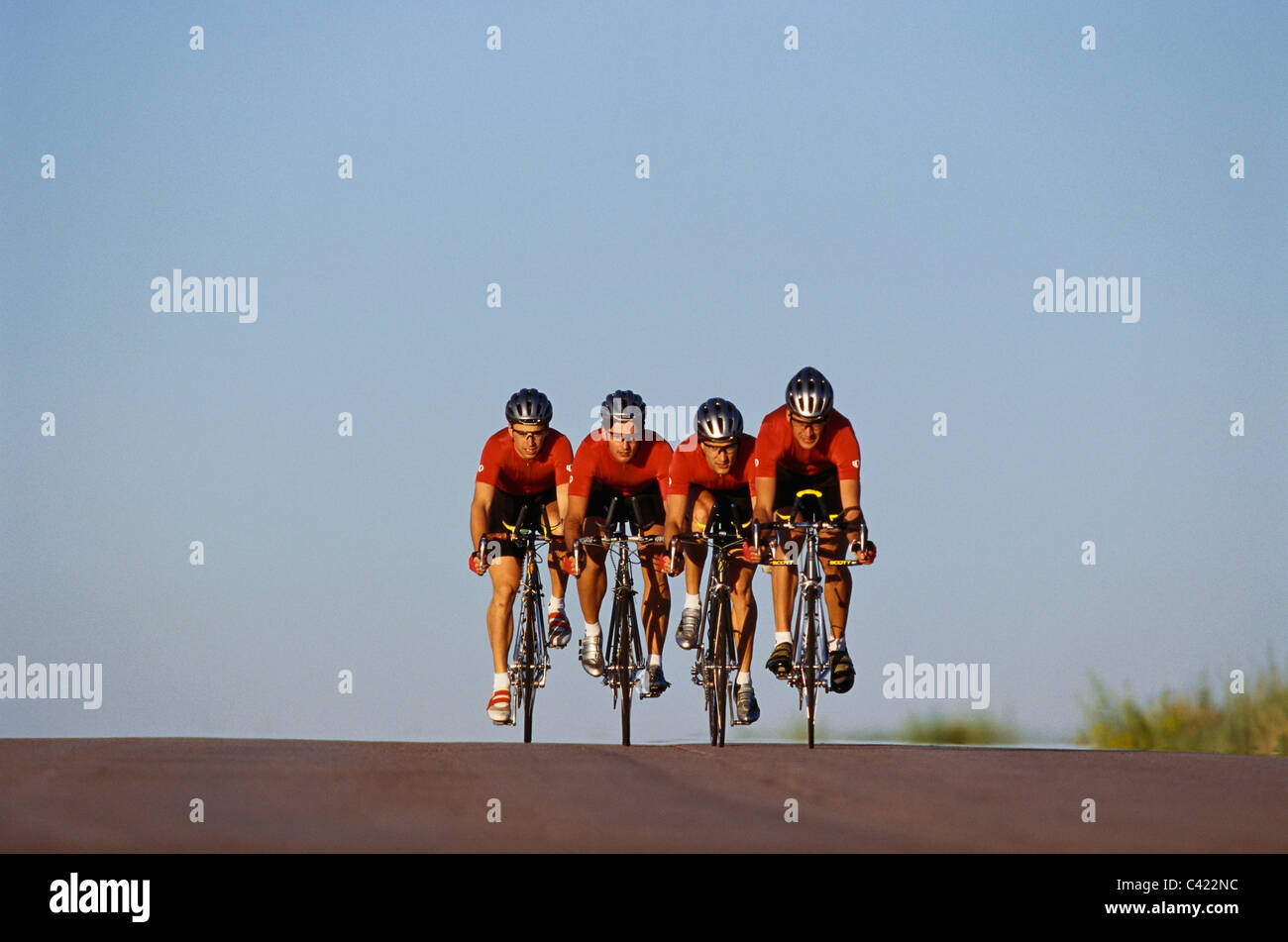 Road cycling team in action Stock Photo - Alamy