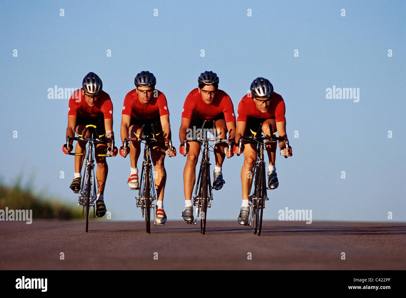 Road cycling team in action Stock Photo - Alamy