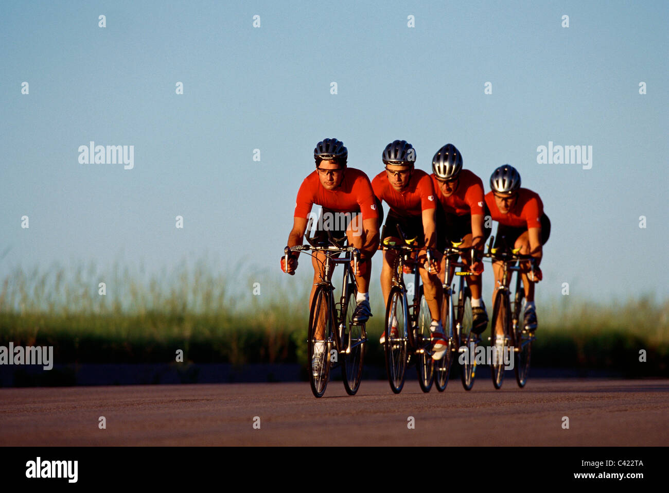 Road cycling team in action Stock Photo - Alamy