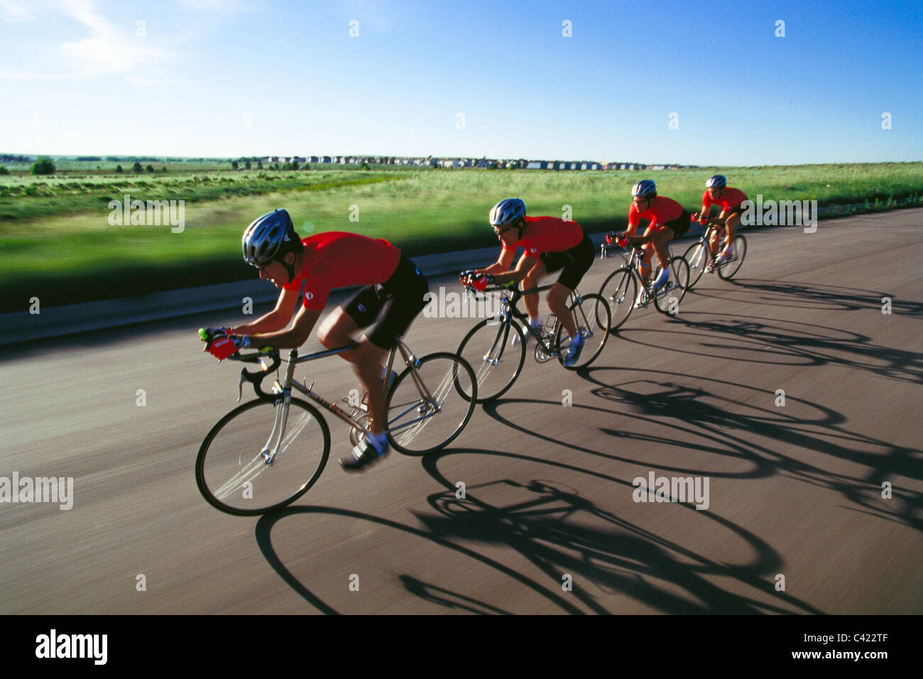 Road cycling team in action Stock Photo - Alamy