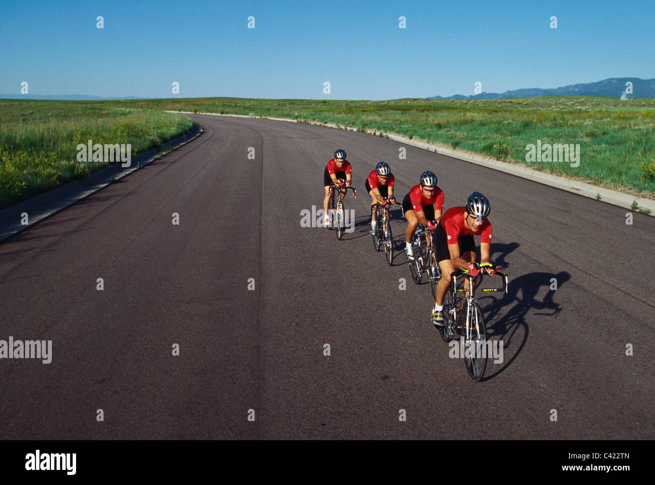Road cycling team in action Stock Photo - Alamy