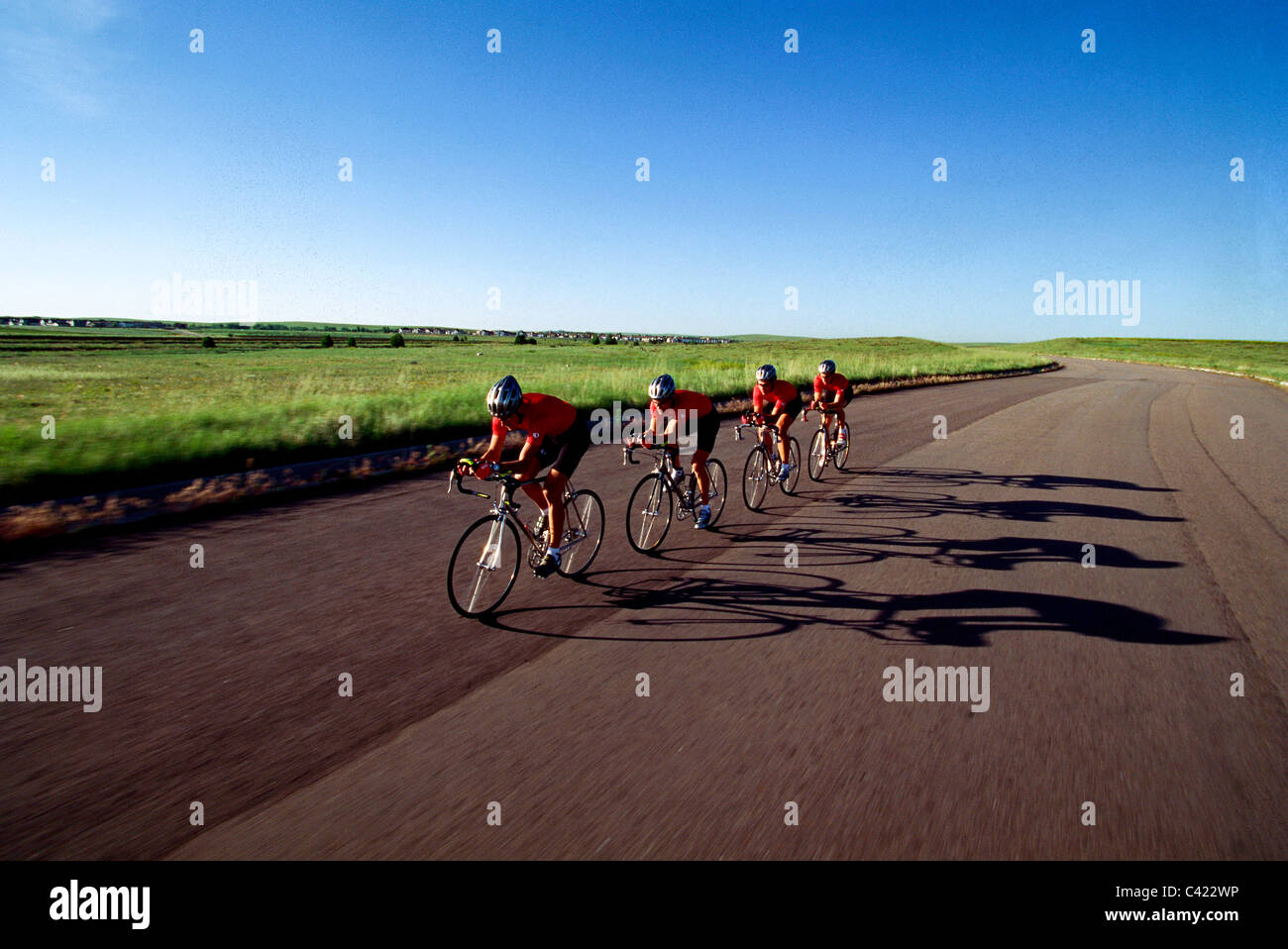 Road cycling team in action Stock Photo - Alamy