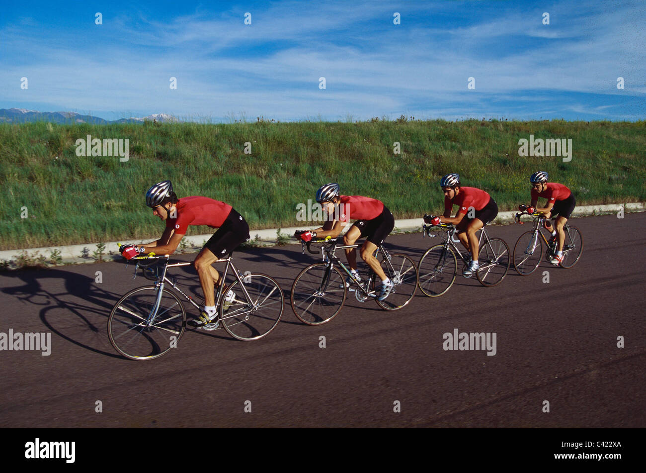 Road cycling team in action Stock Photo - Alamy