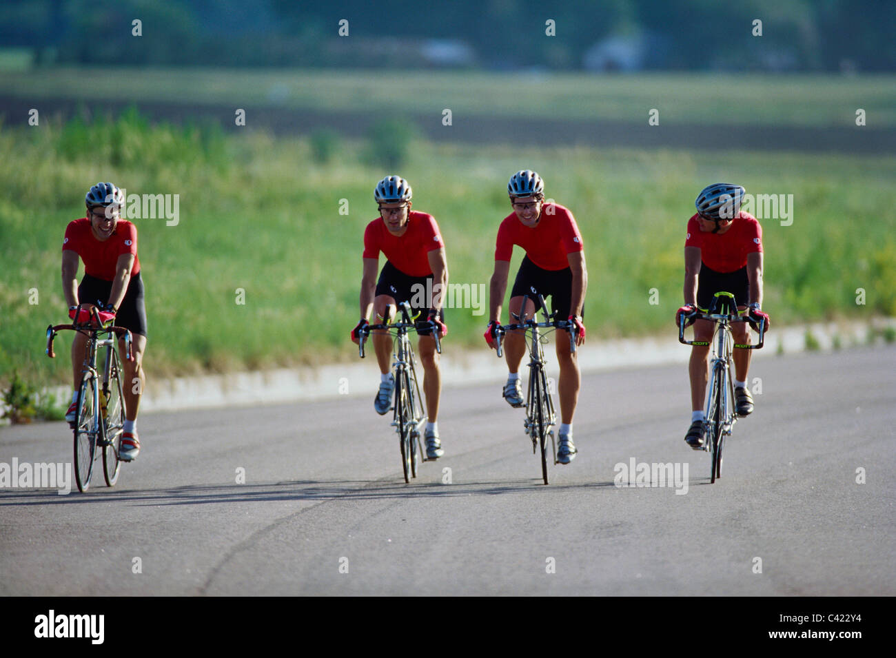 Road cycling team in action Stock Photo - Alamy