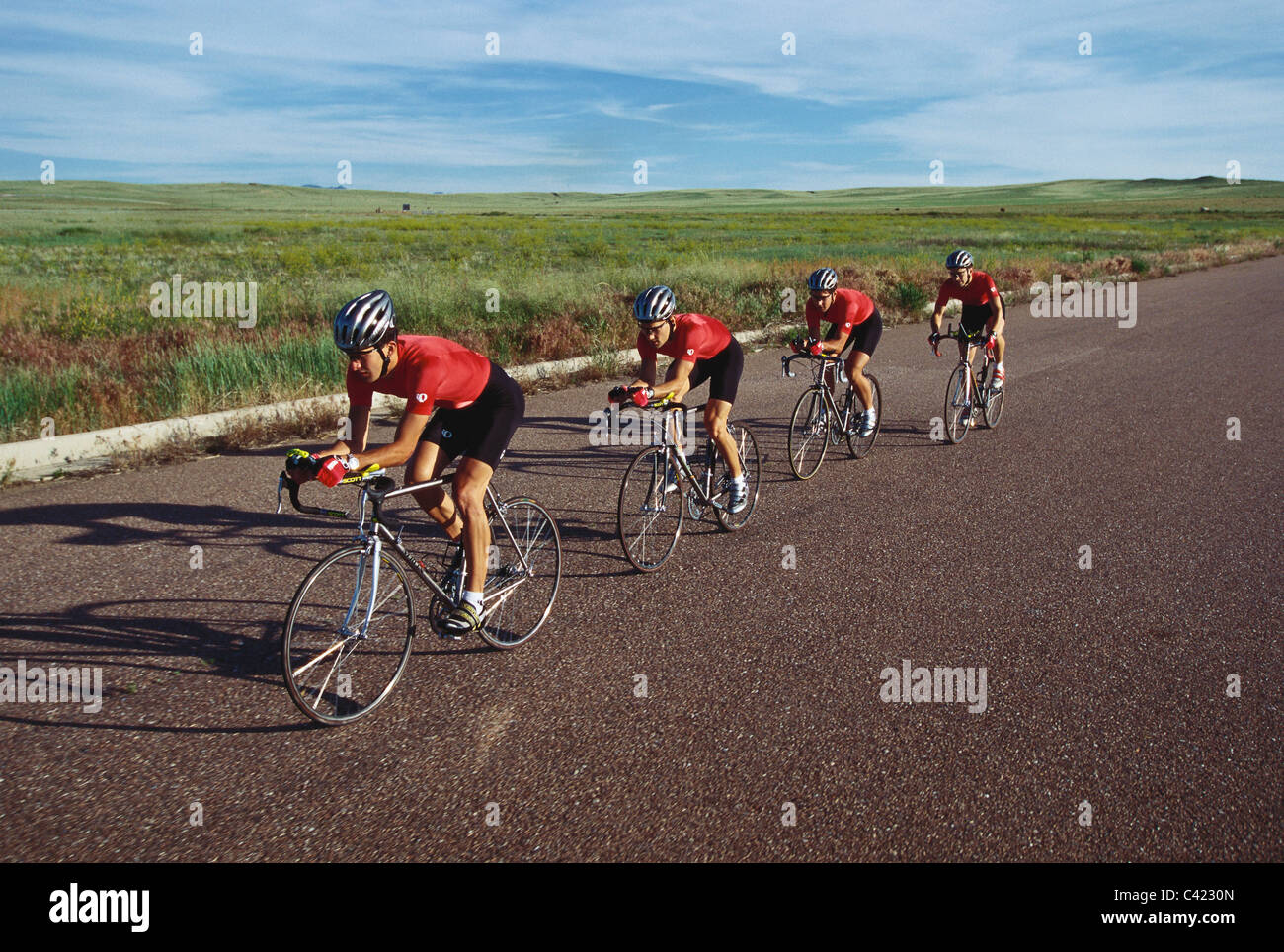 Road cycling team in action Stock Photo - Alamy