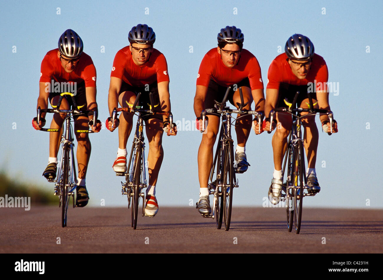 Road cycling team in action Stock Photo - Alamy