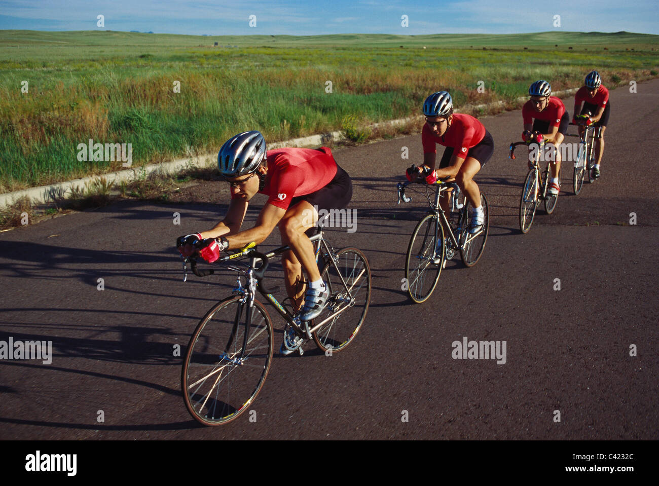 Road cycling team in action Stock Photo - Alamy