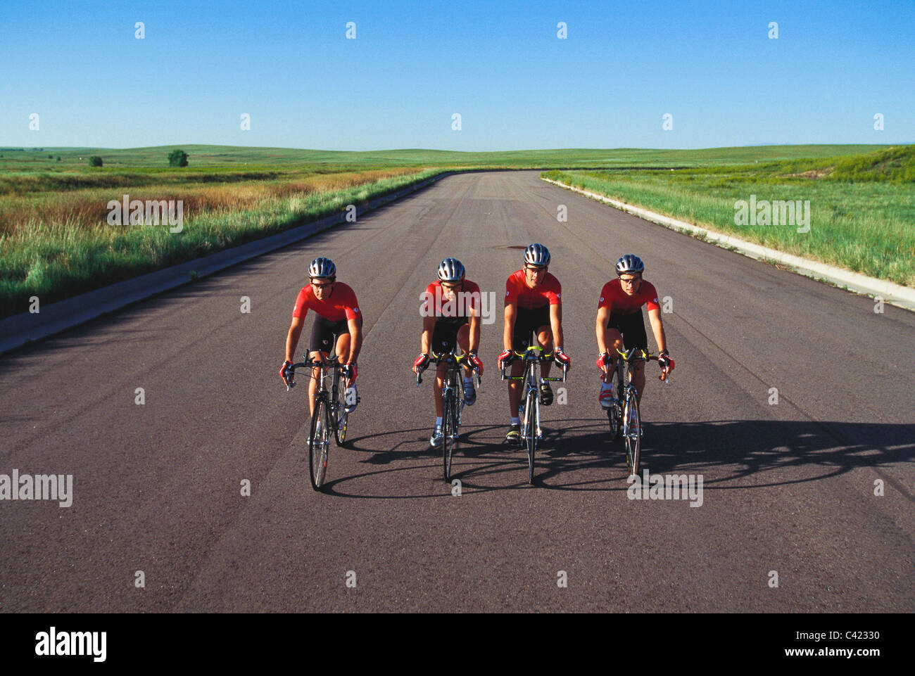 Road cycling team in action Stock Photo - Alamy