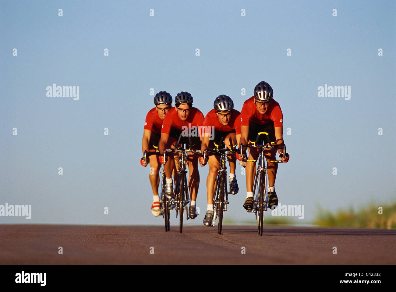 Road cycling team in action Stock Photo - Alamy