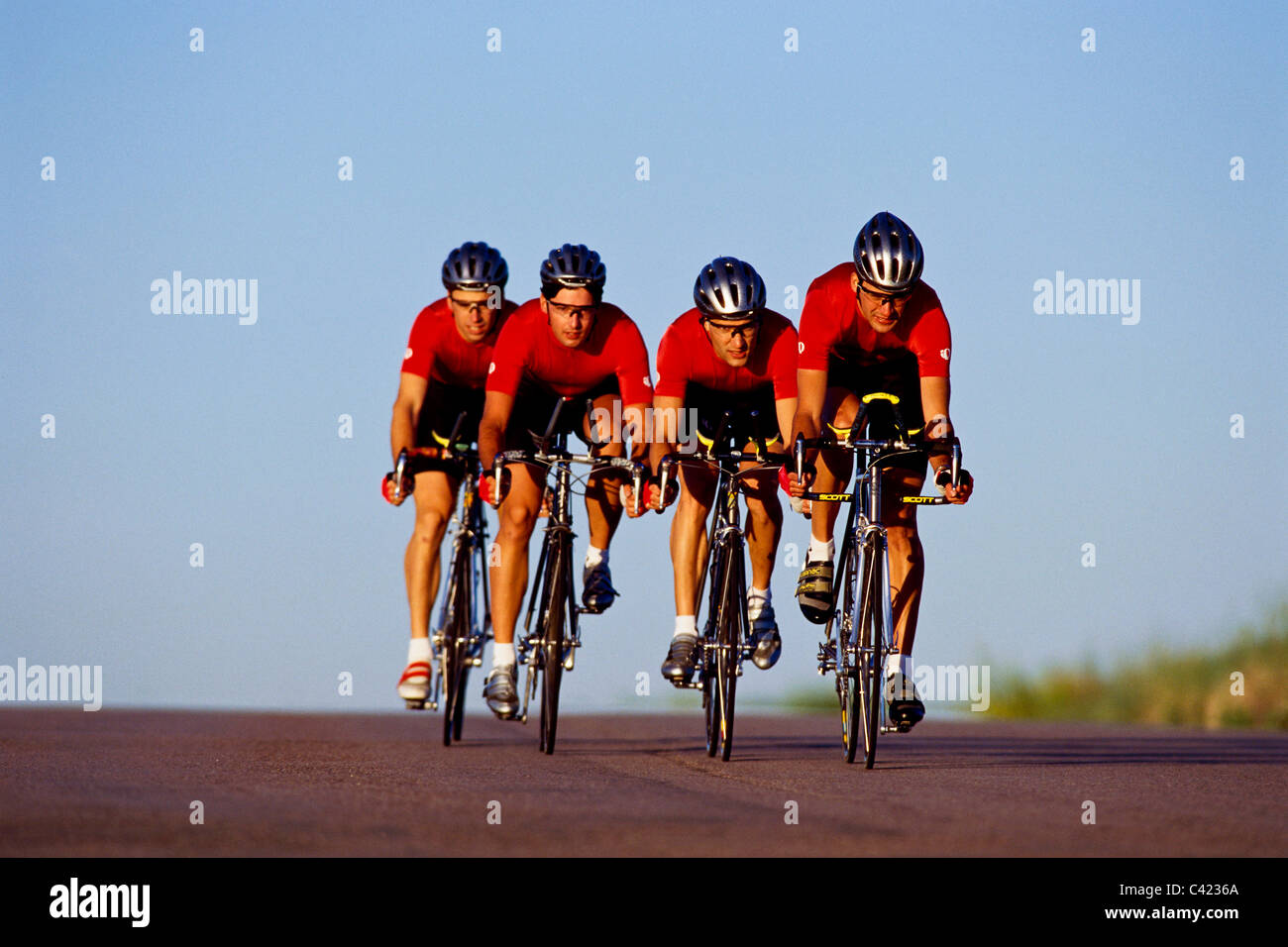 Road cycling team in action Stock Photo - Alamy