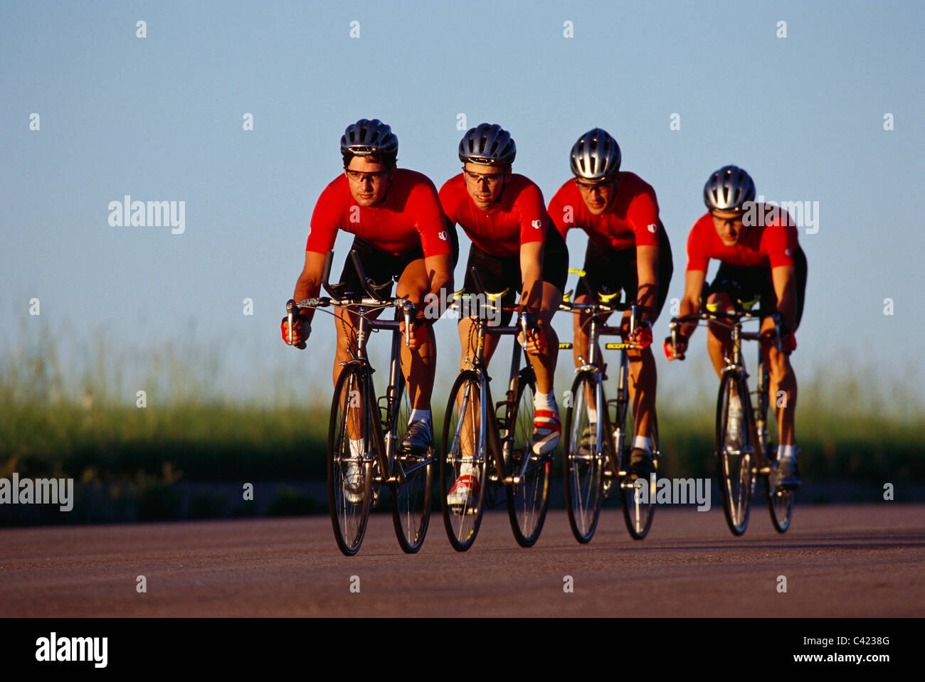 Road cycling team in action Stock Photo - Alamy