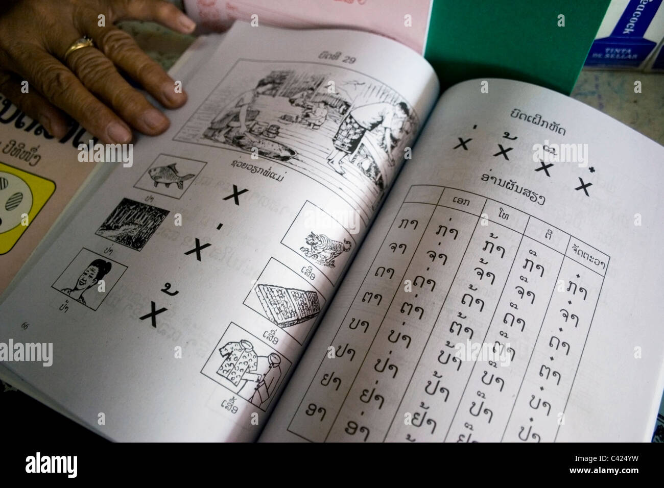 Official Lao government primary school textbooks are for sale at a ...