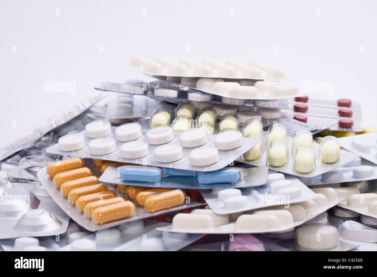Lots of pills, isolated on white background Stock Photo - Alamy