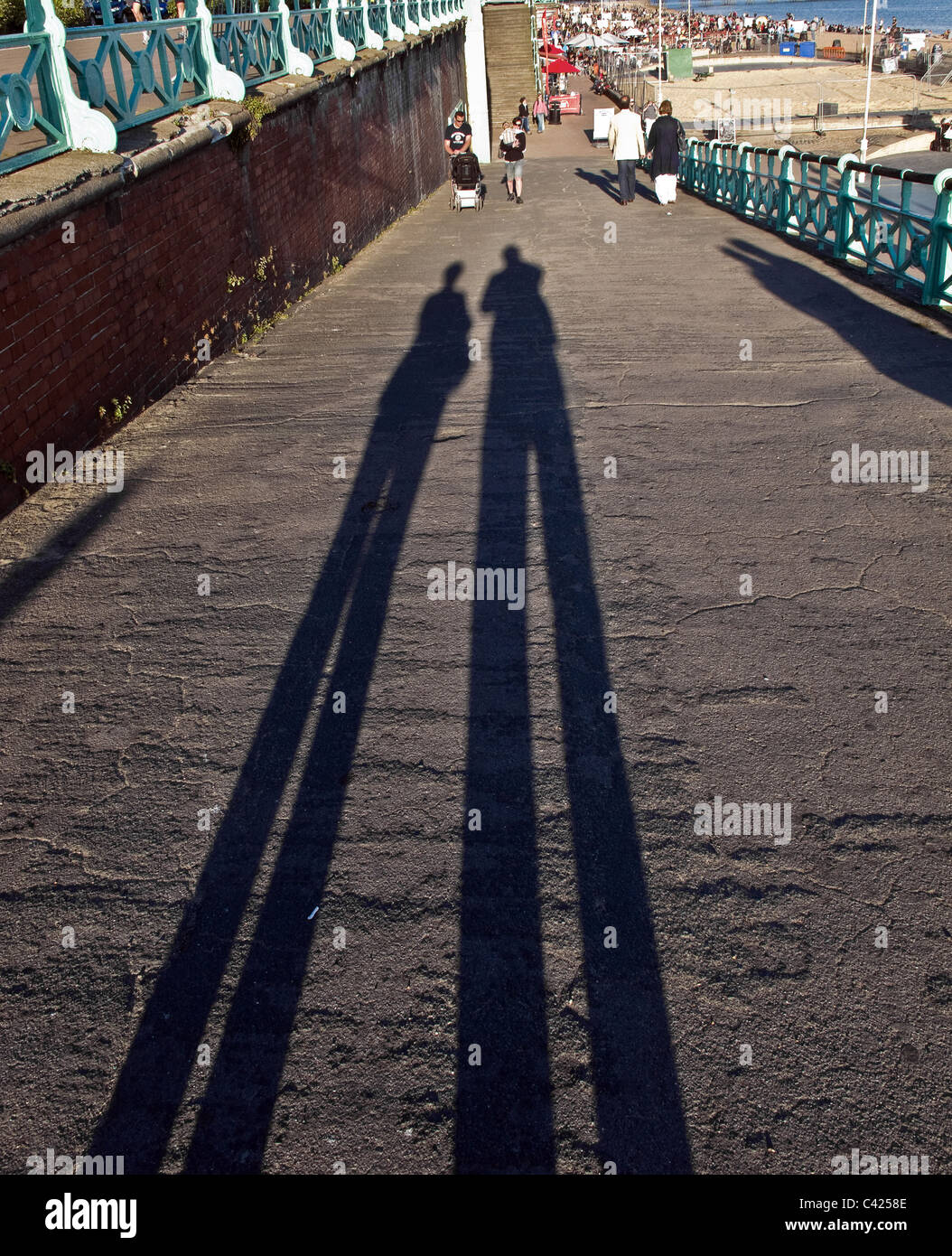 Long shadows cast two people hi-res stock photography and images - Alamy