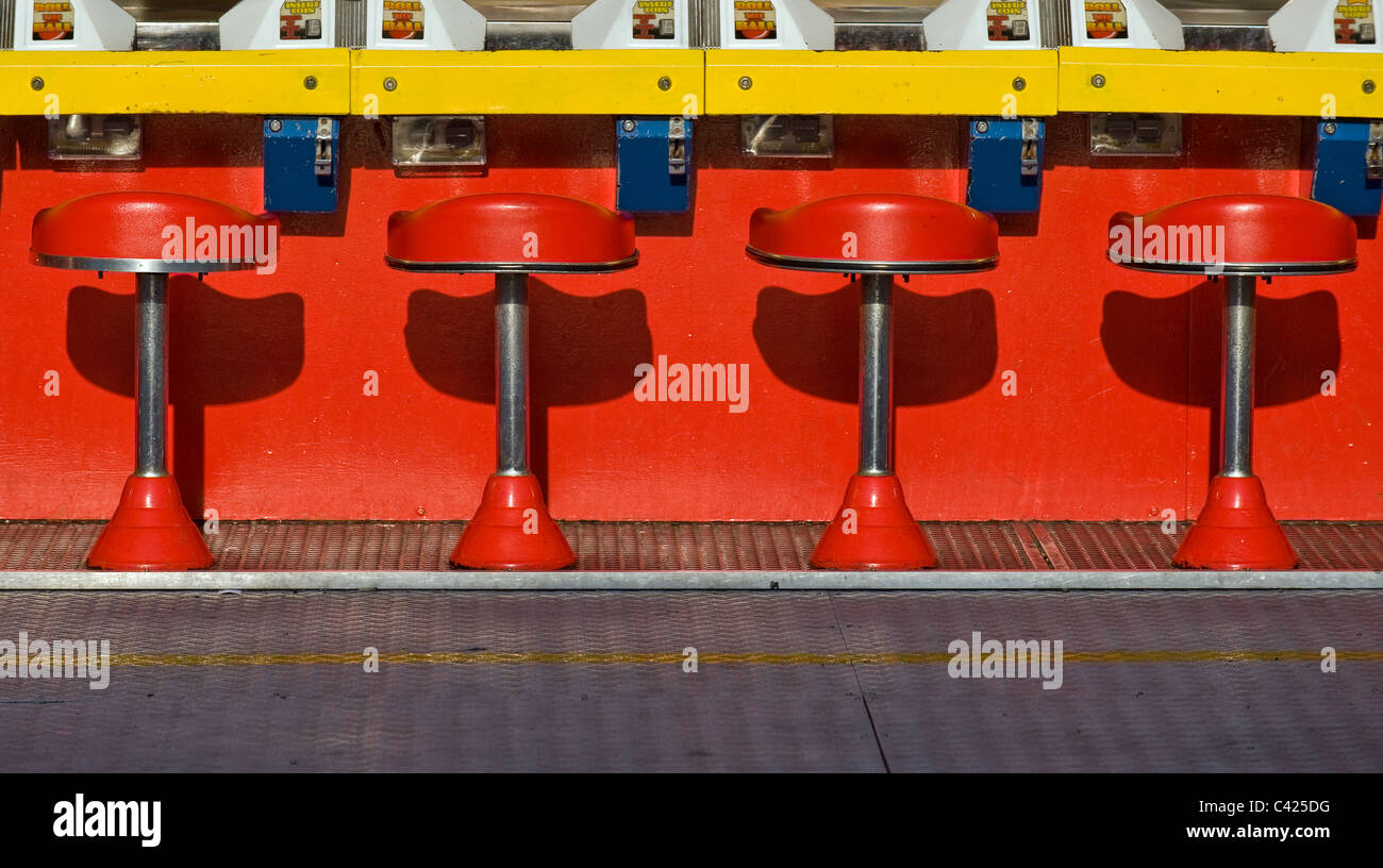 Empty seats at a fairground ride on Brighton Pier. Photo by Gordon ...