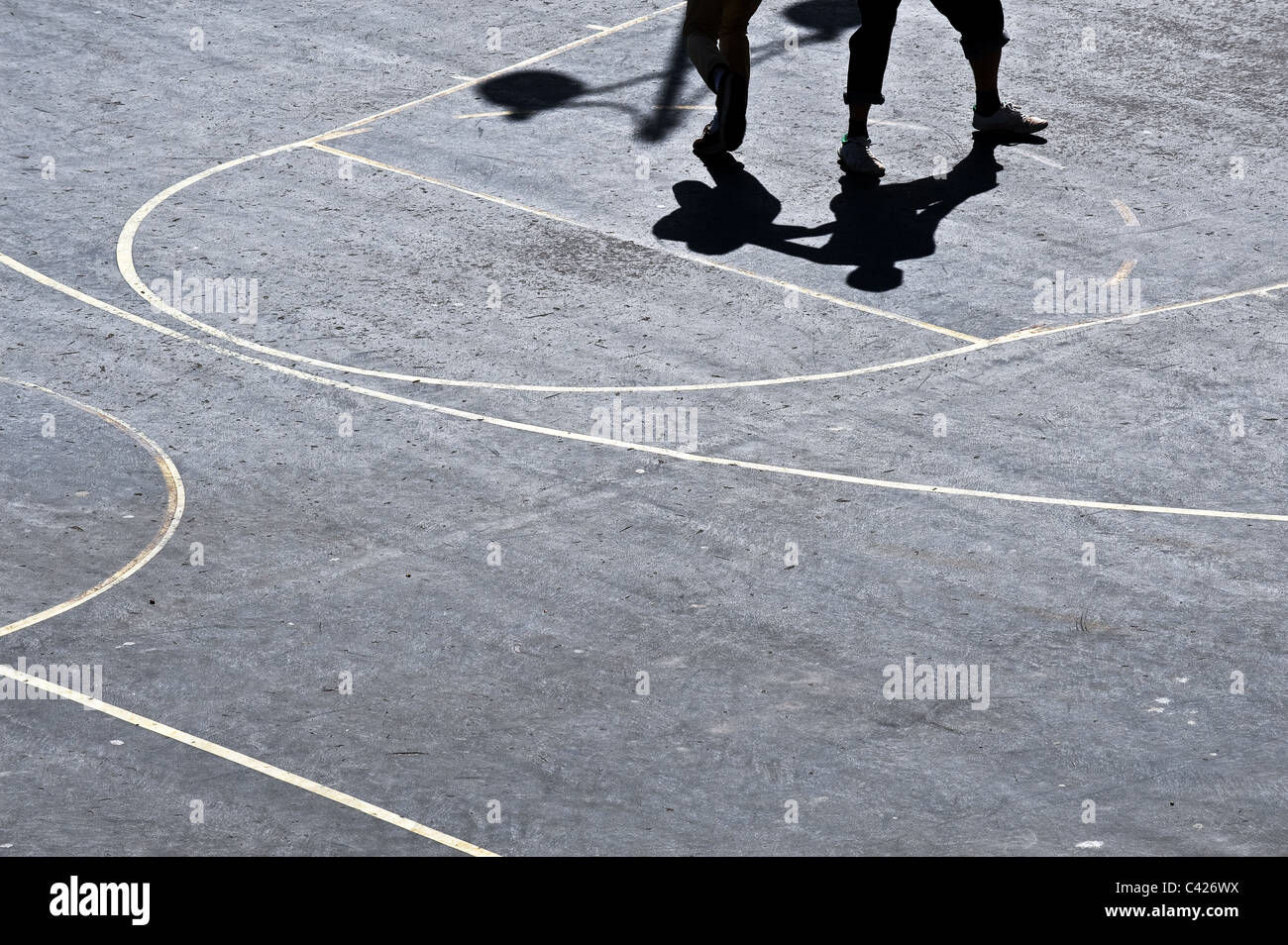 Shadows cast by basketball players. Photo by Gordon Scammell Stock ...