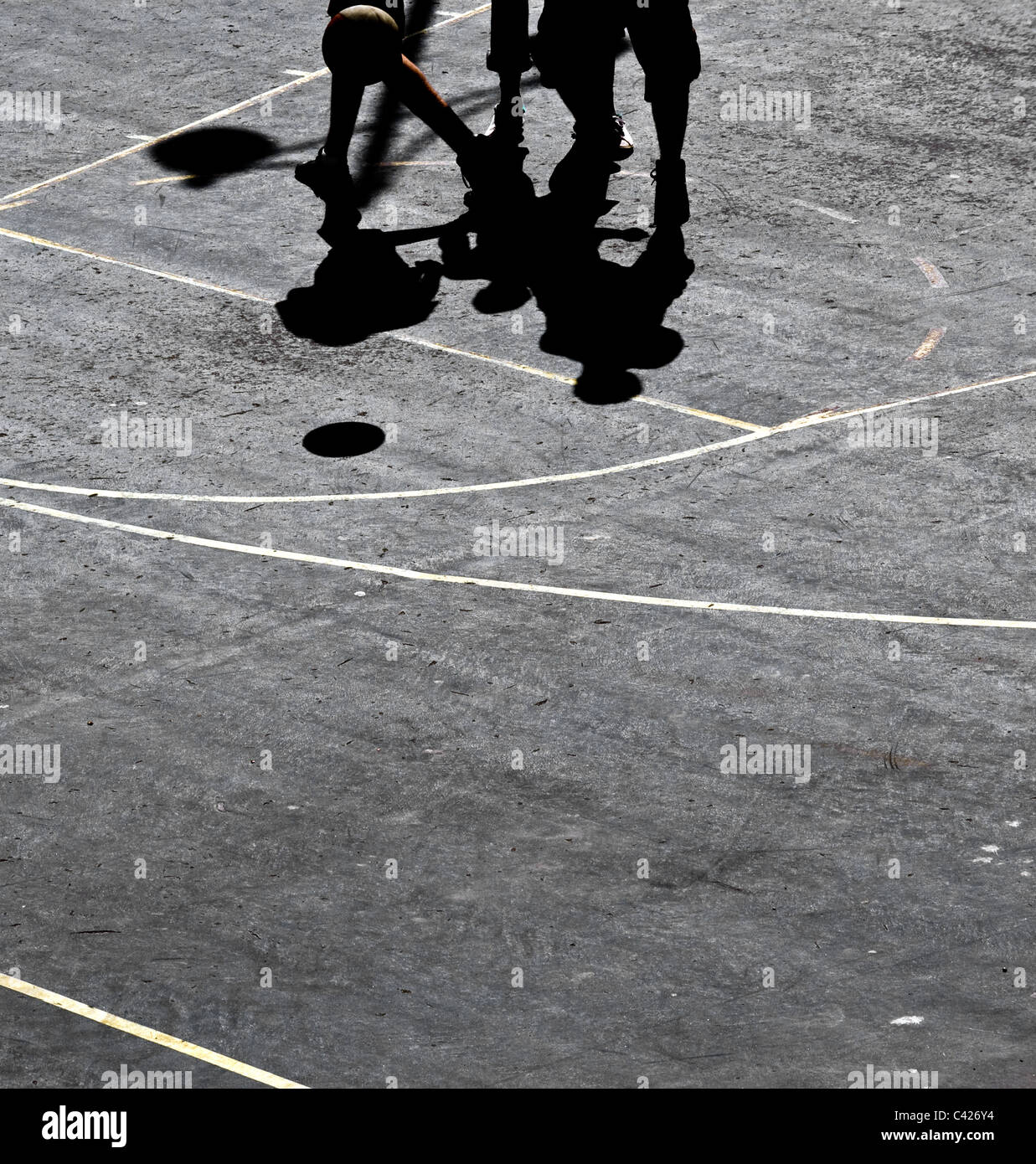 Shadows cast by basketball players. Photo by Gordon Scammell Stock ...