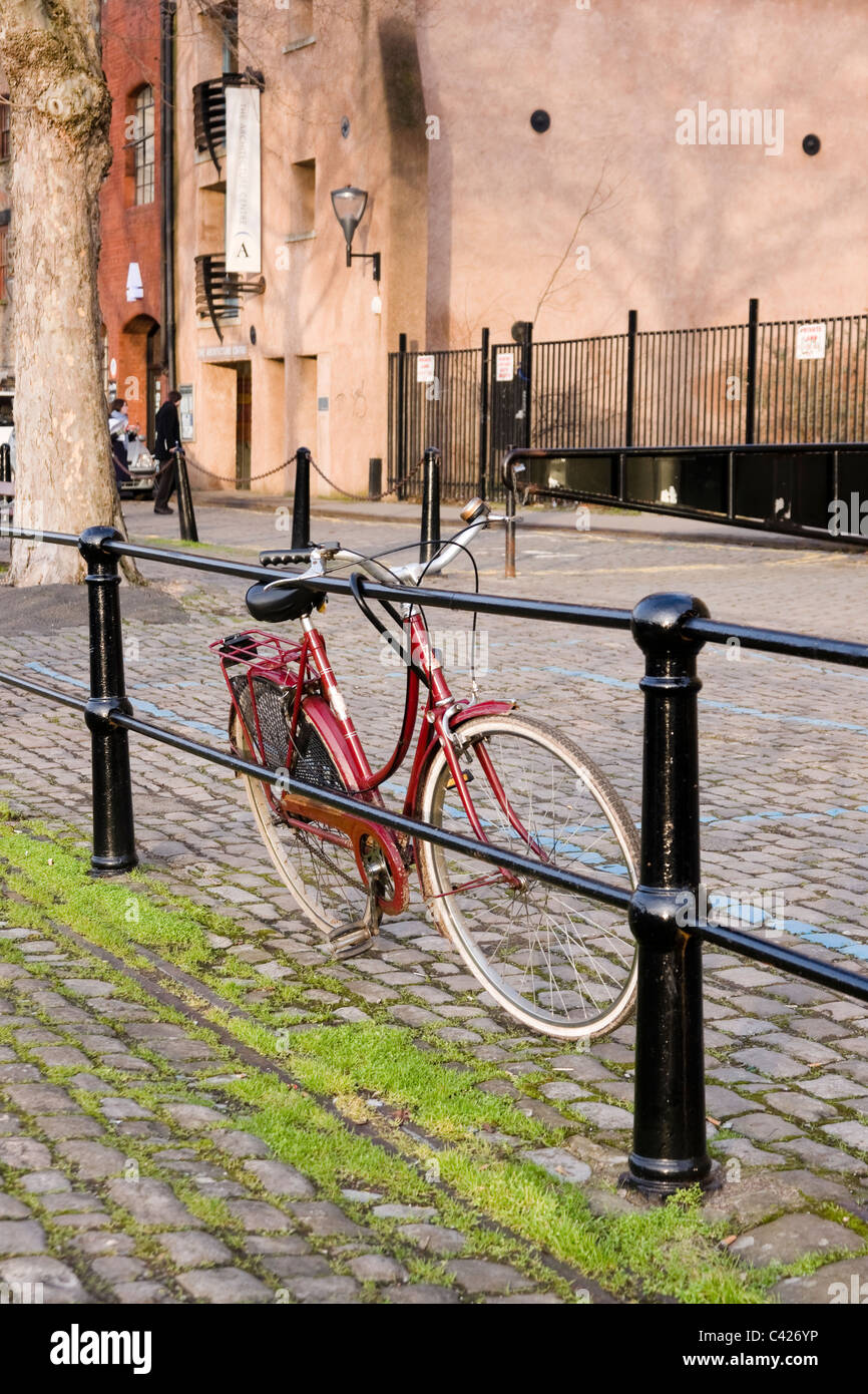 Bicycle on railings Bristol Harbour Stock Photo - Alamy