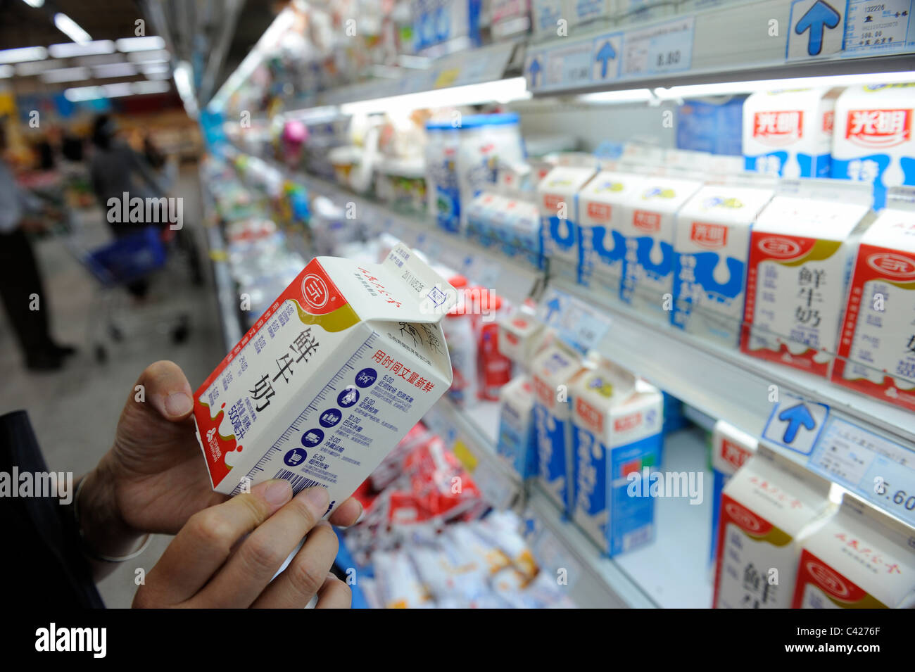 Chinese customer buying dairy products at a Wumart supermarket in ...
