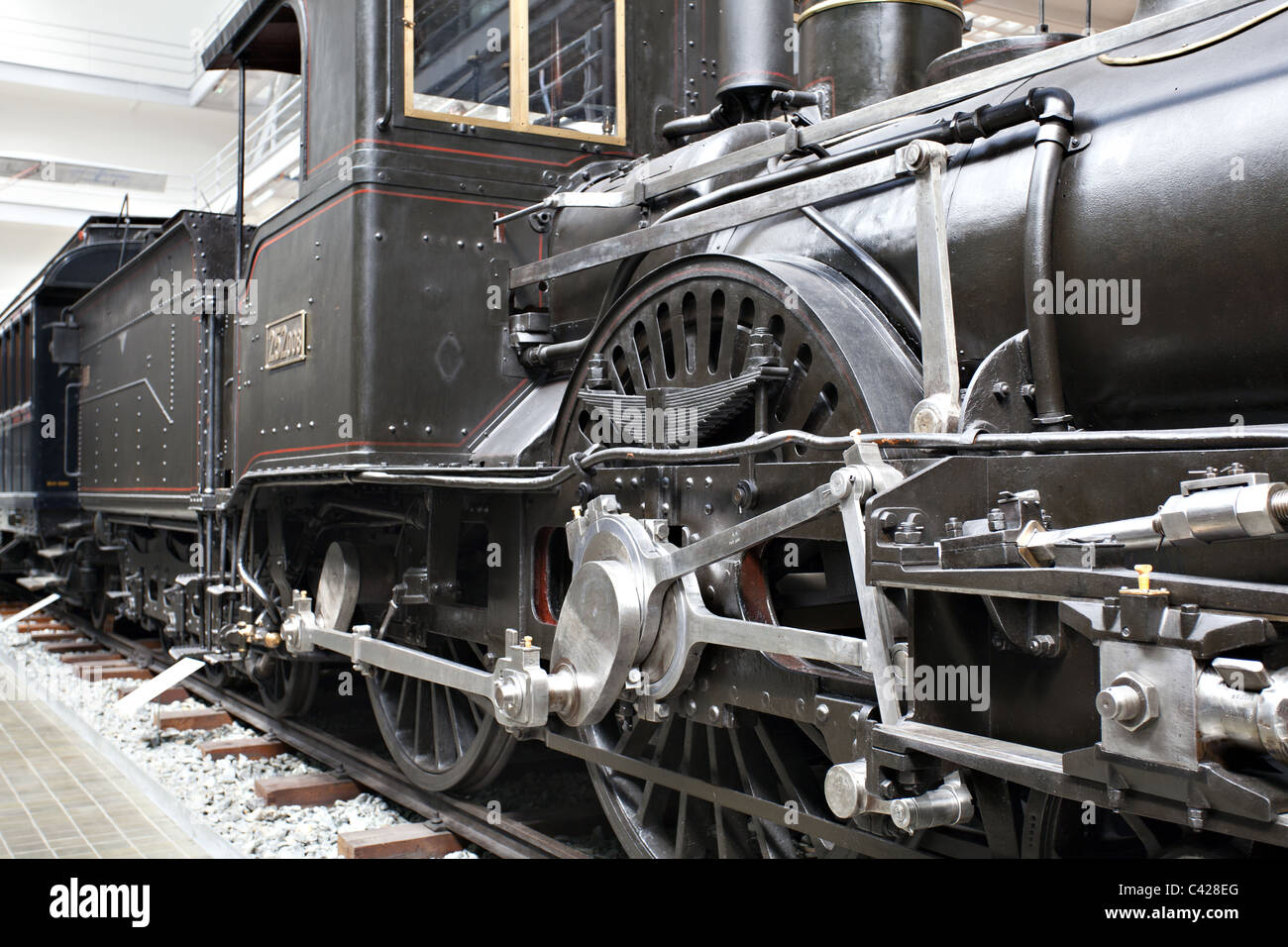 Closeup of vintage steam engine's black, iron wheel Stock Photo - Alamy