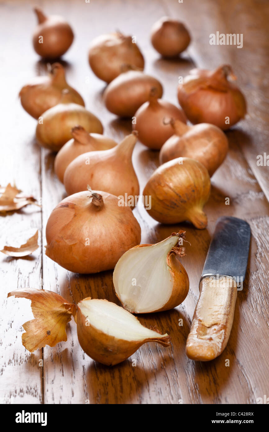 A group of small onions on a table Stock Photo - Alamy