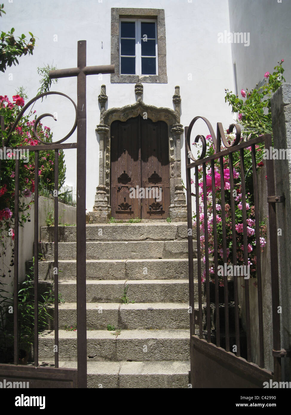 Gate with cross, Portugal Stock Photo - Alamy
