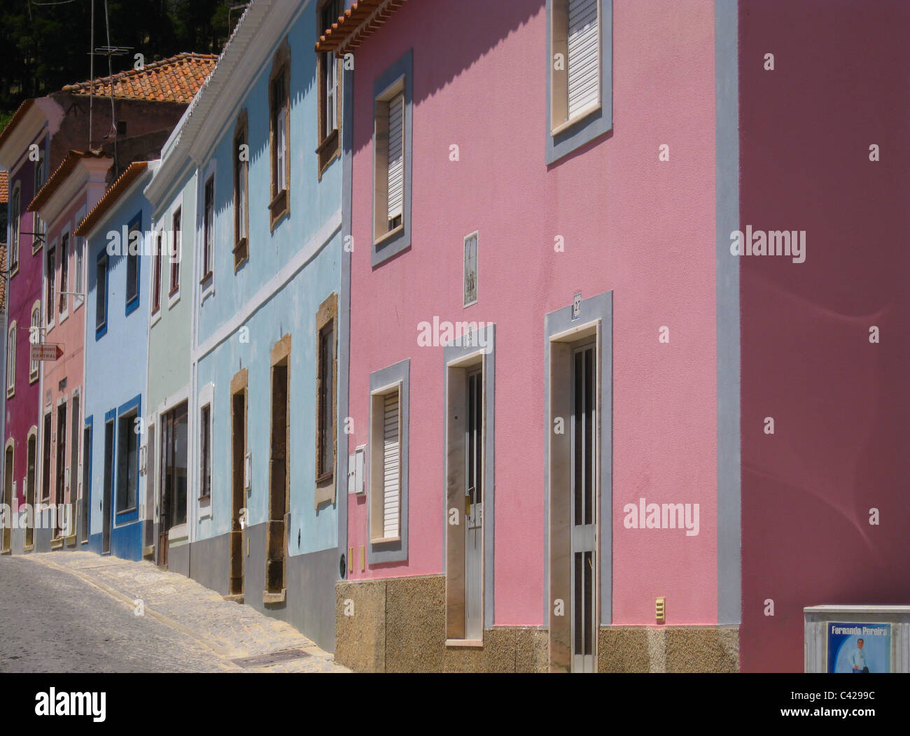The traditional pastel blue and pink colours of Monchique houses Stock ...