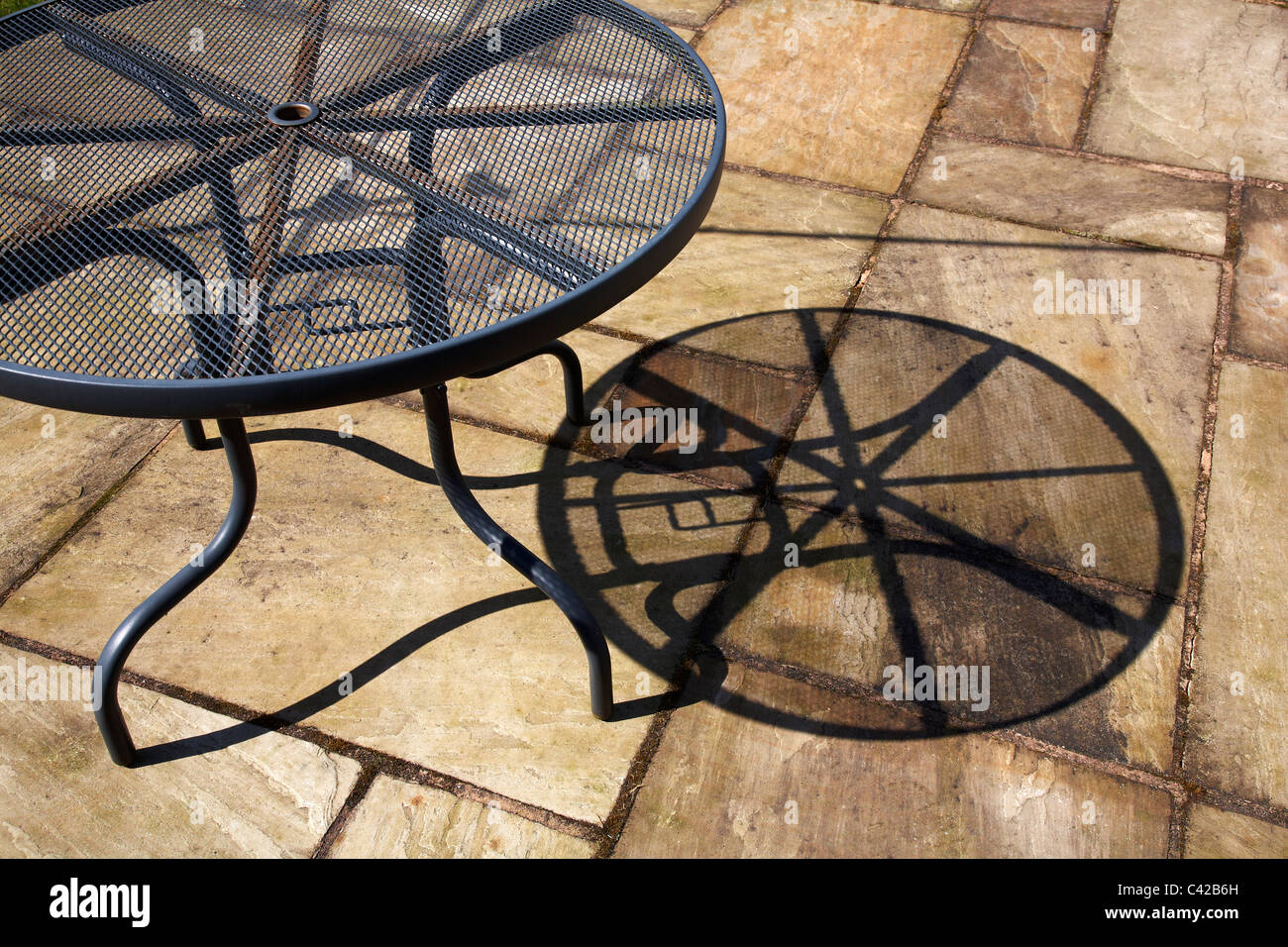 Shadow play from outside table on patio Stock Photo - Alamy