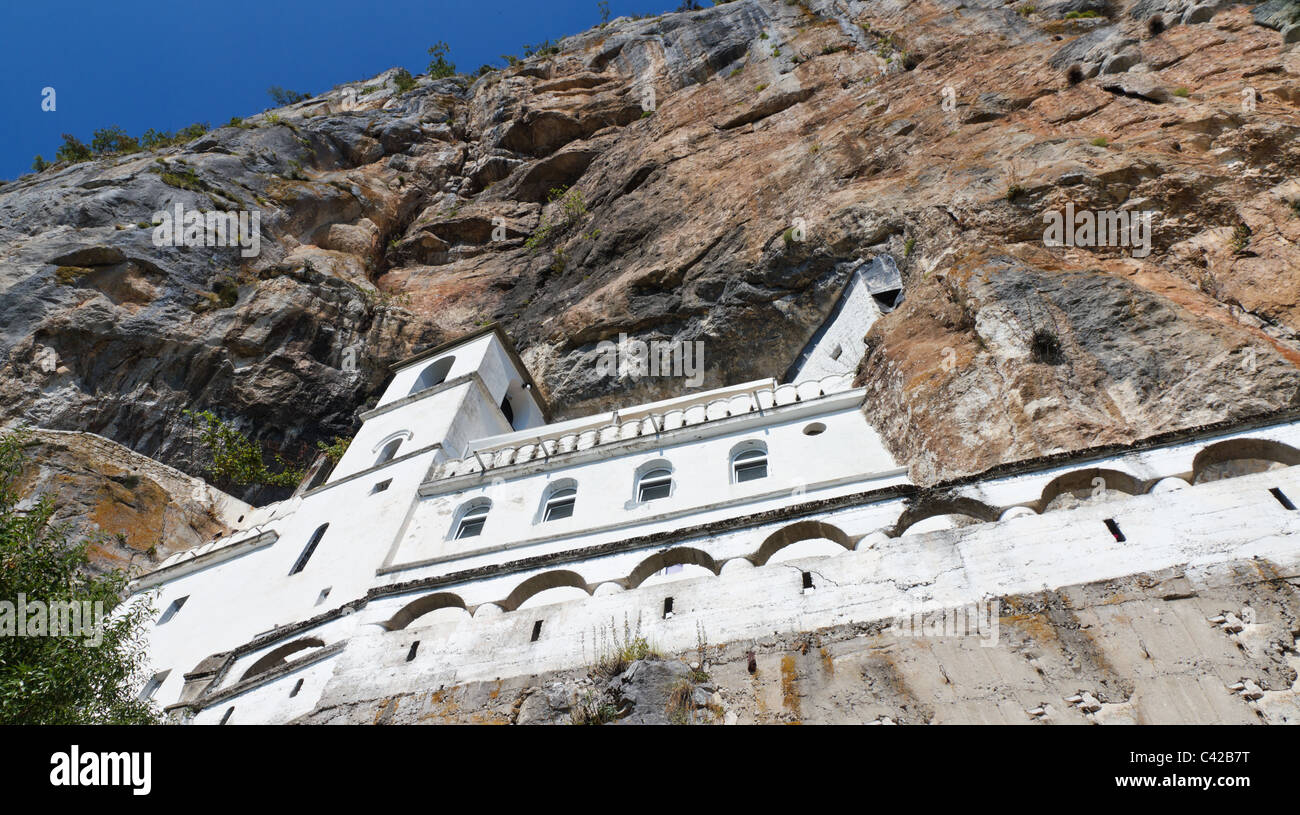 Monastery of Ostrog built into a rock face vertical view, Montenegro ...