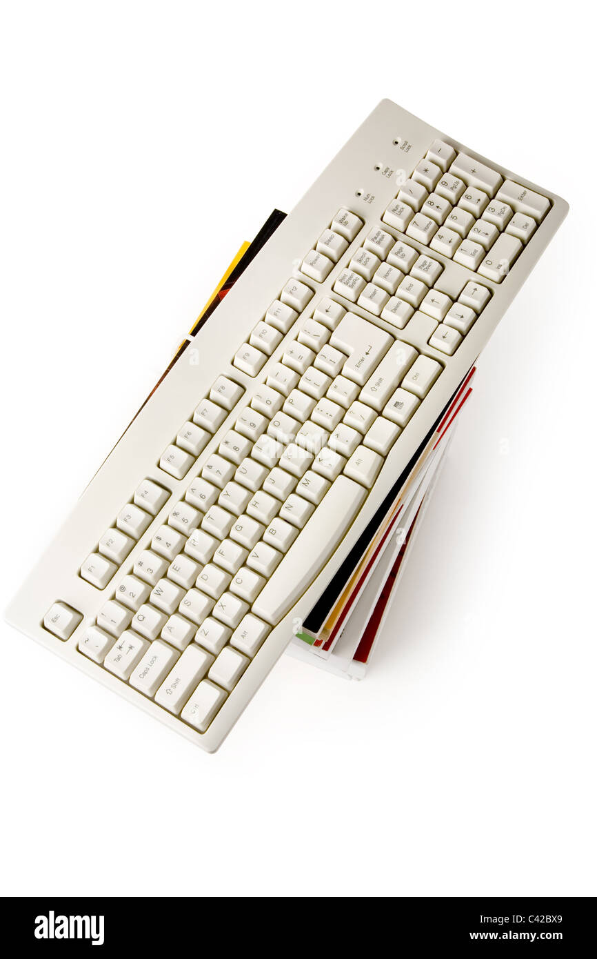 book and computer keyboard, concept of online learning Stock Photo - Alamy