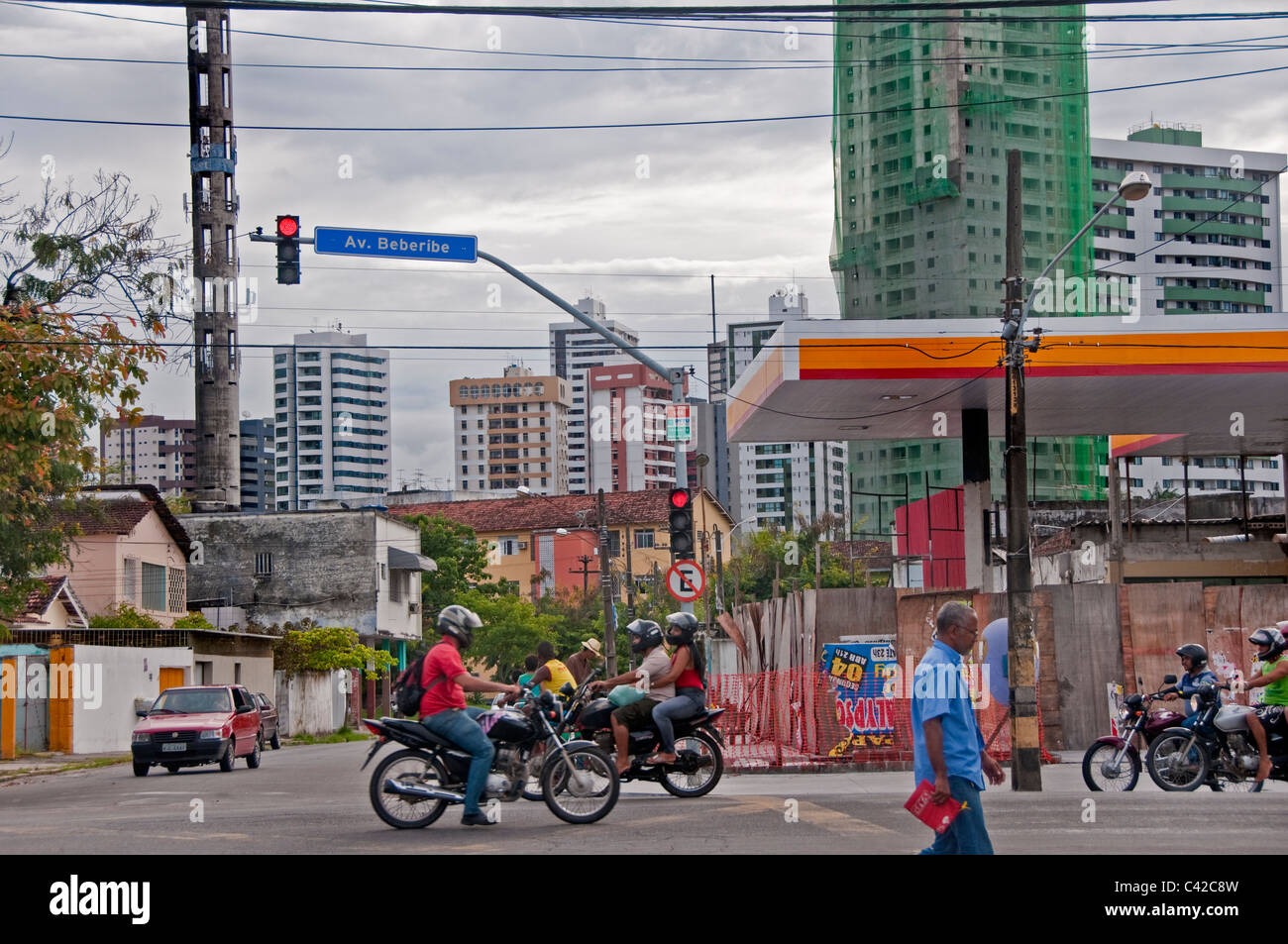 General busy rich and poor street in Recife Brazil with motorbikes ...
