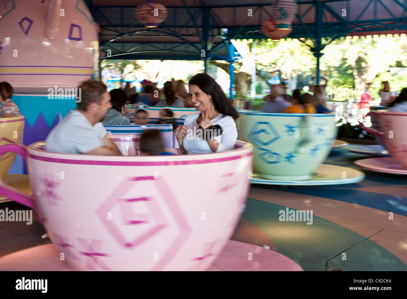 Fast blurred motion of the Mad Tea Party attraction ride in Fantasyland ...