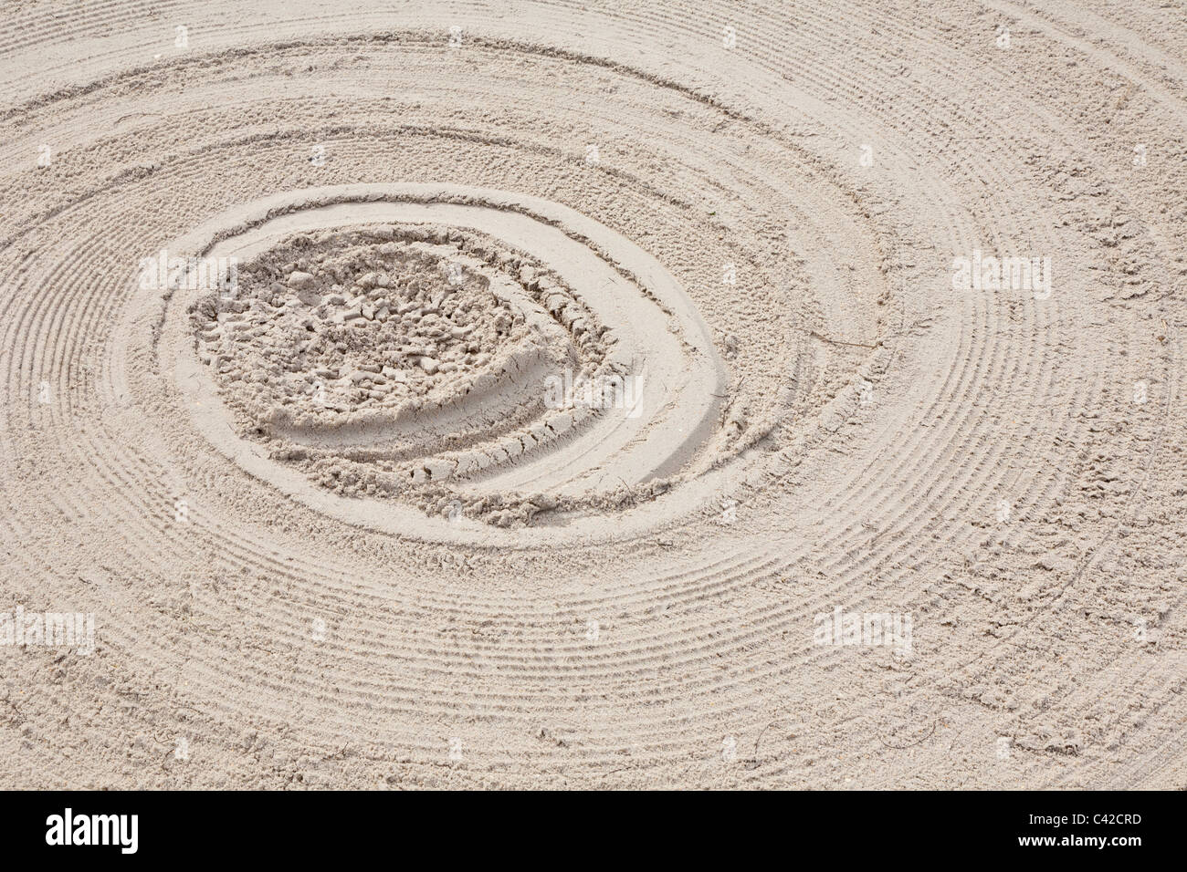 Circular spiral pattern in sand Stock Photo - Alamy