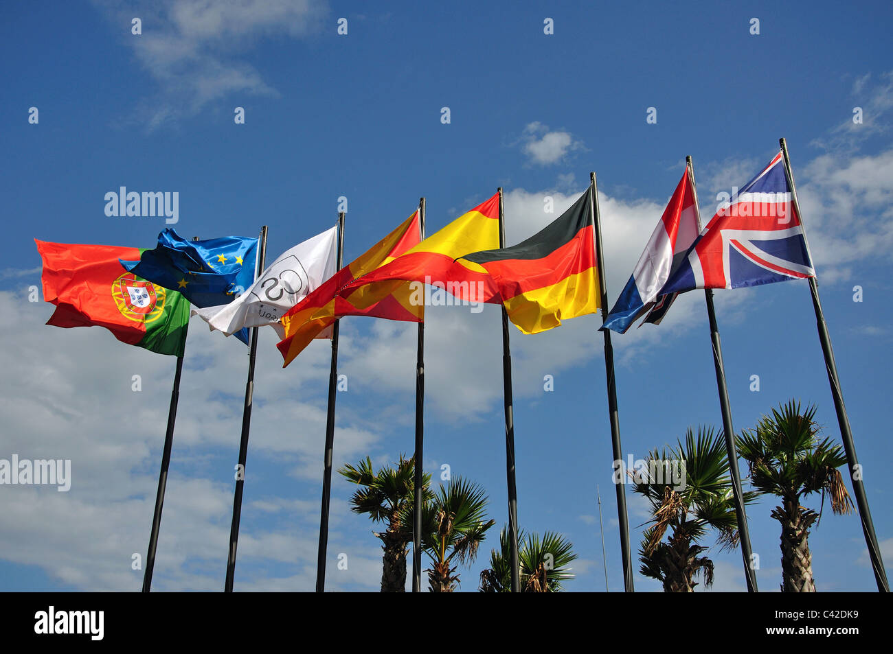 European flags outside hotel, near Praia da Oura, Faro District ...