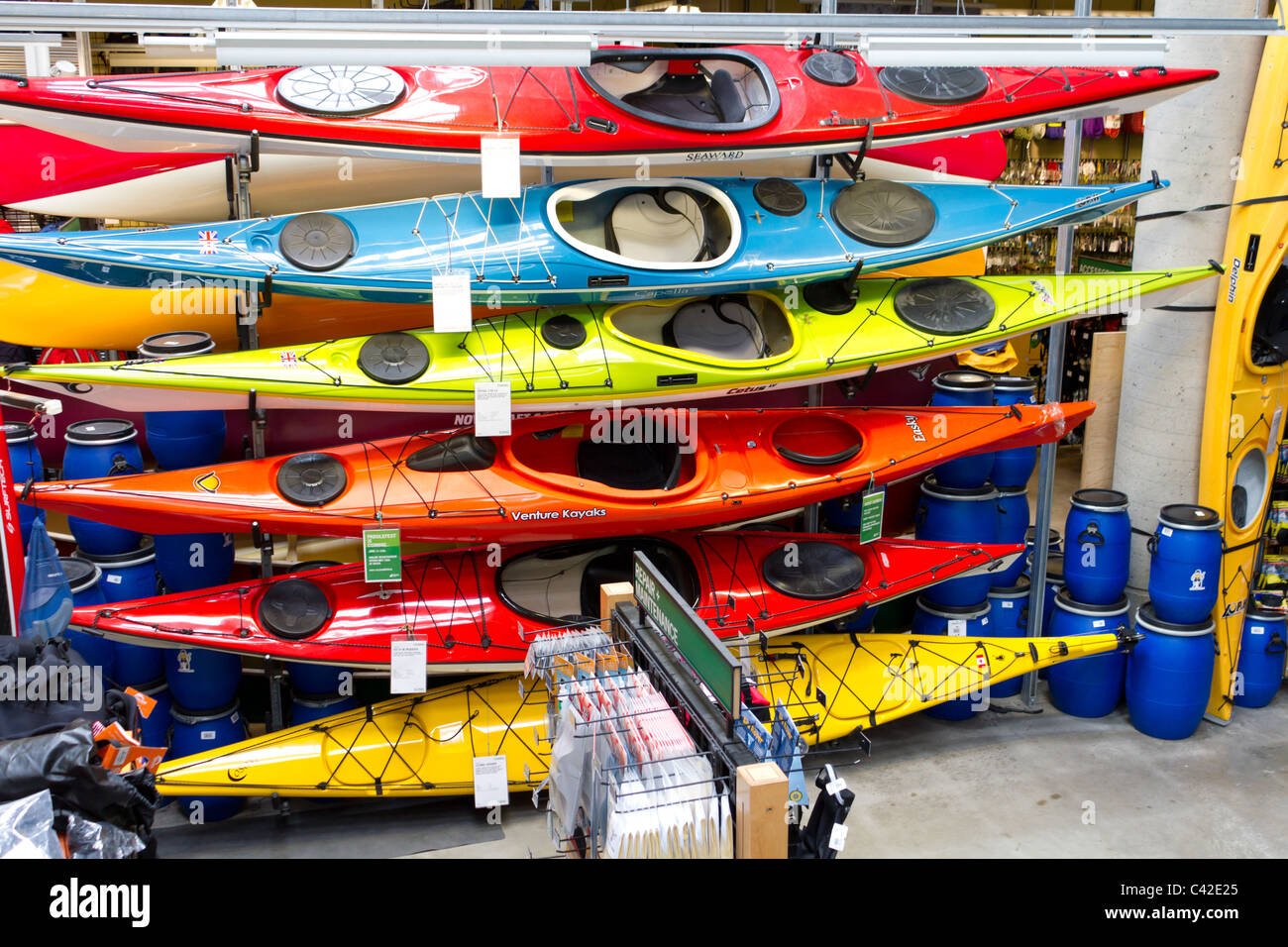 kayak colorful boats store sale Stock Photo - Alamy