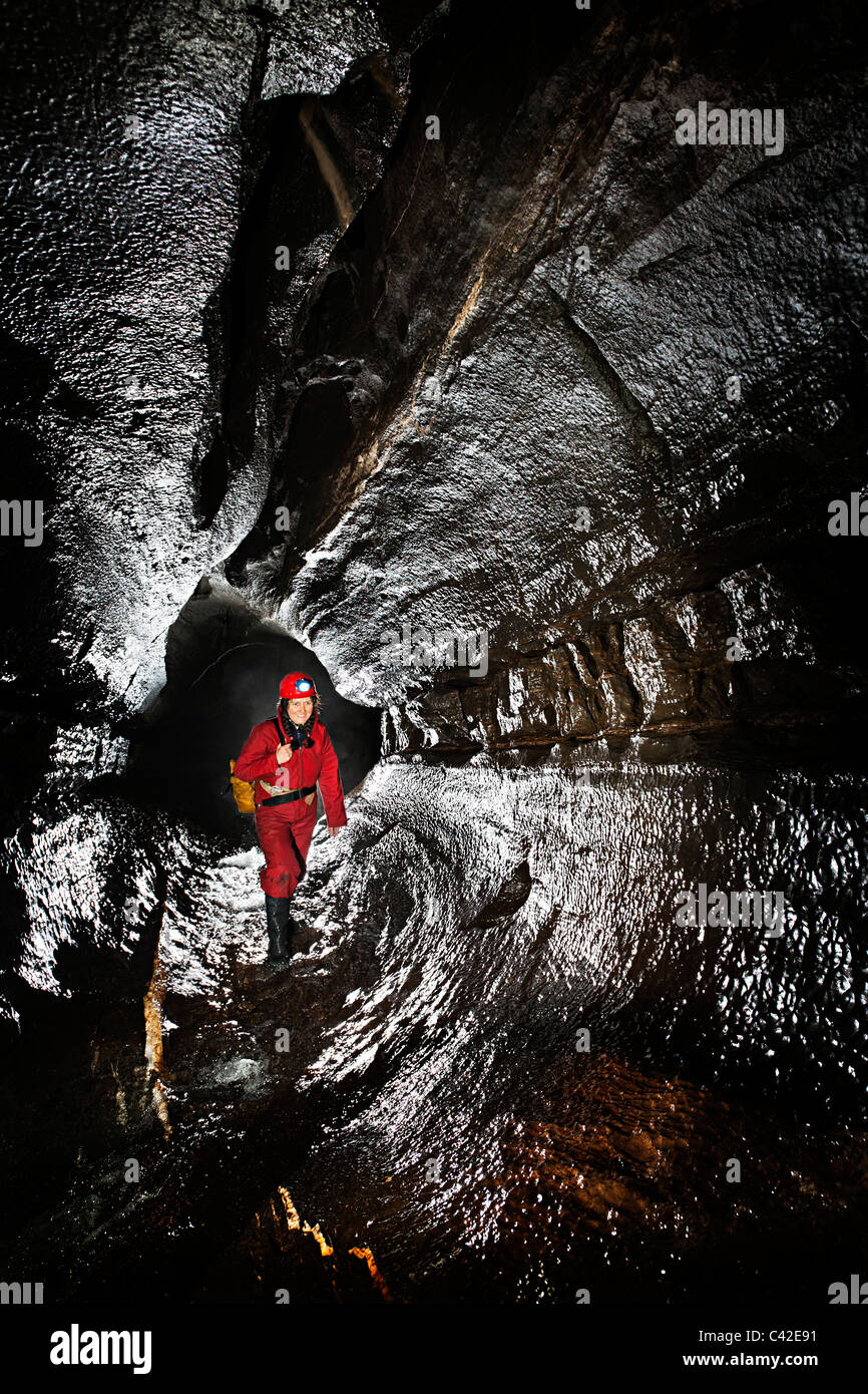 Female caver in cave passage Ogof Ffynnon Ddu Wales UK Stock Photo - Alamy