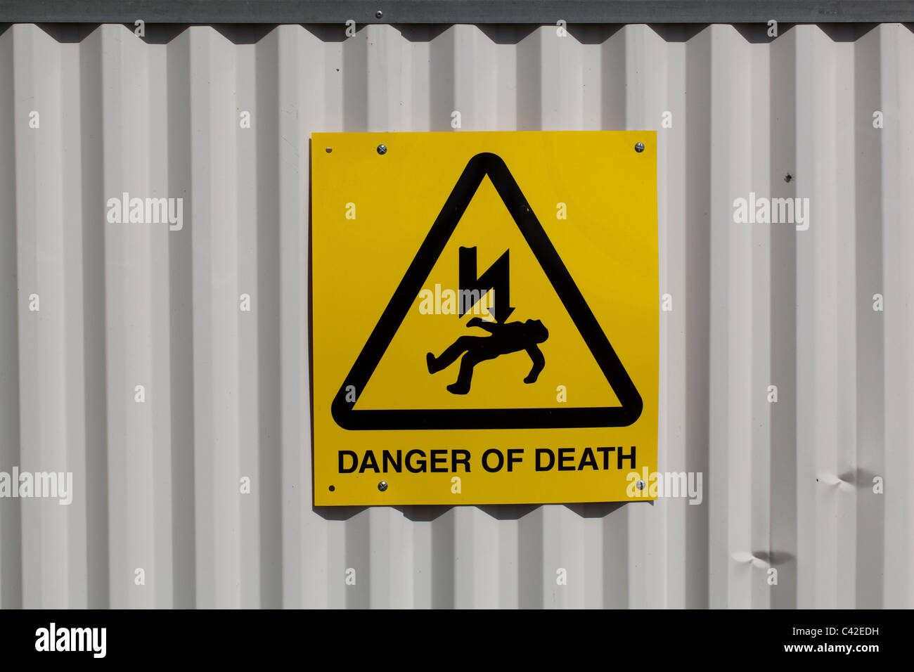 Sign. Health and Safety, 'DANGER of DEATH', on a perimeter fence to a ...