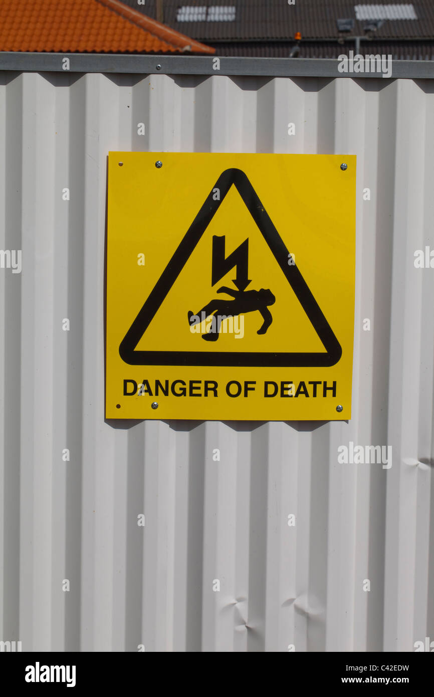 Sign. Health and Safety, 'DANGER of DEATH', on a perimeter fence to a ...