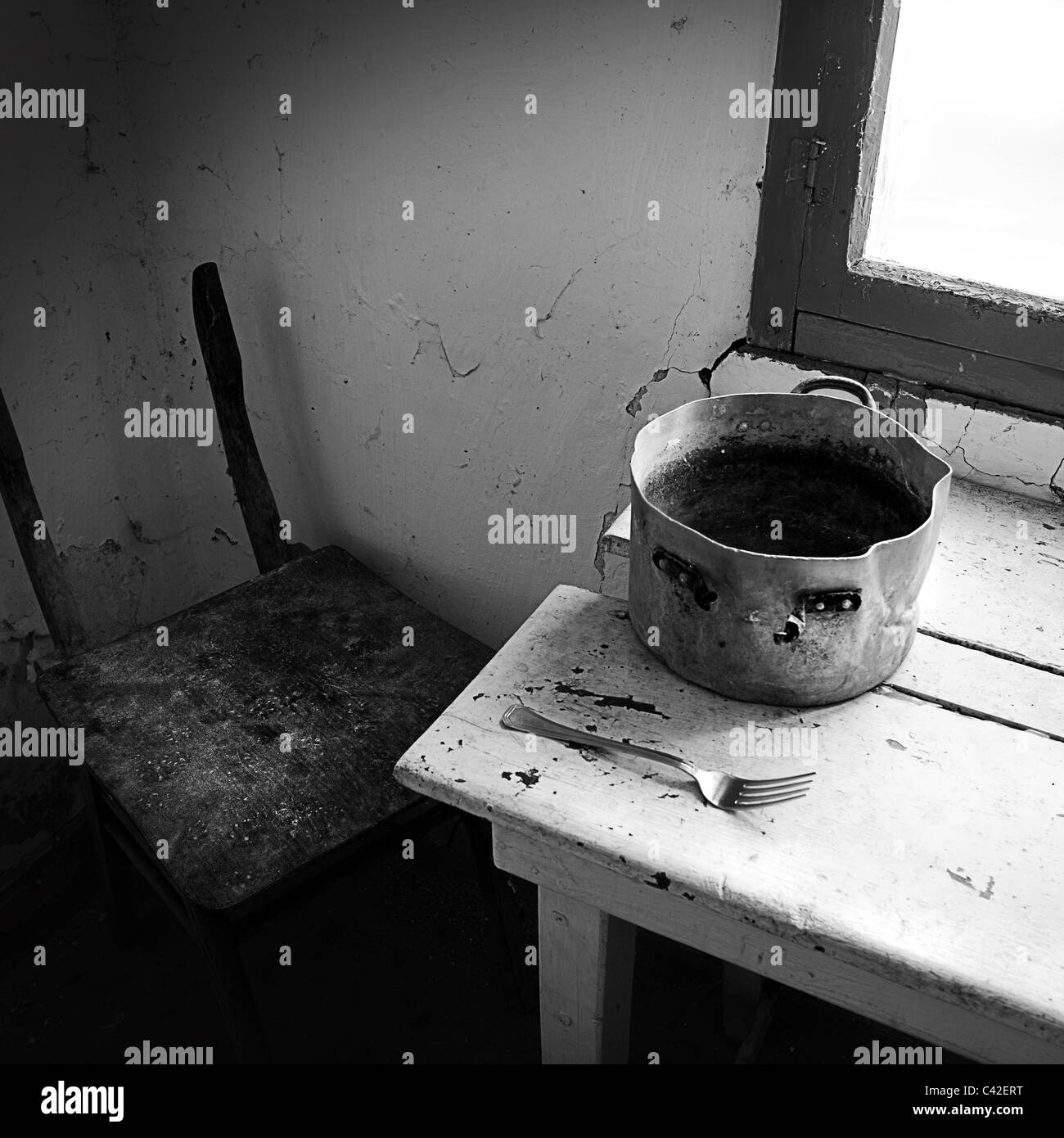 old empty saucepan and fork Stock Photo - Alamy