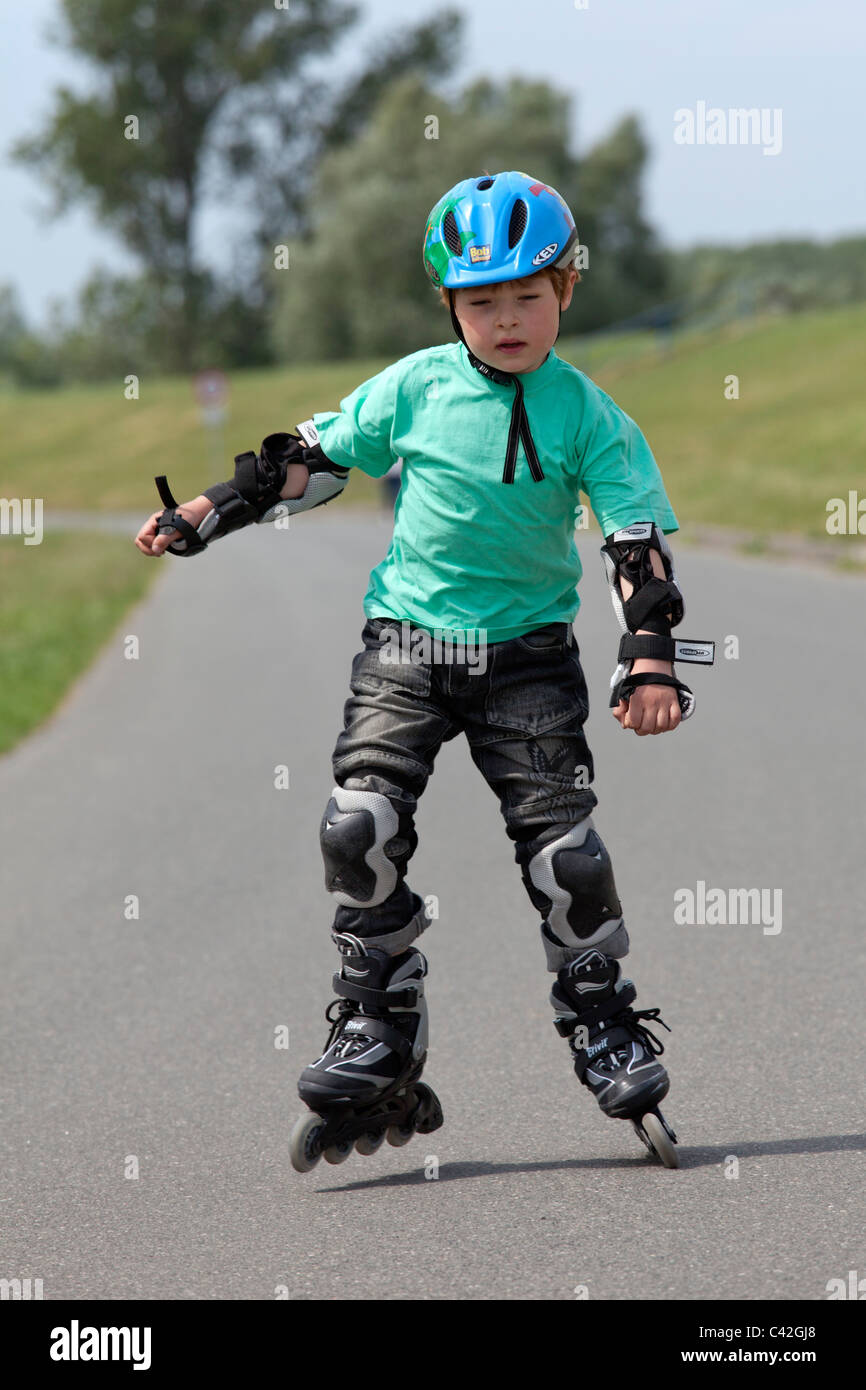 young boy in-line skating Stock Photo - Alamy