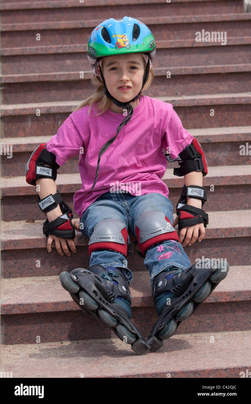young girl having a break from in-line skating Stock Photo - Alamy