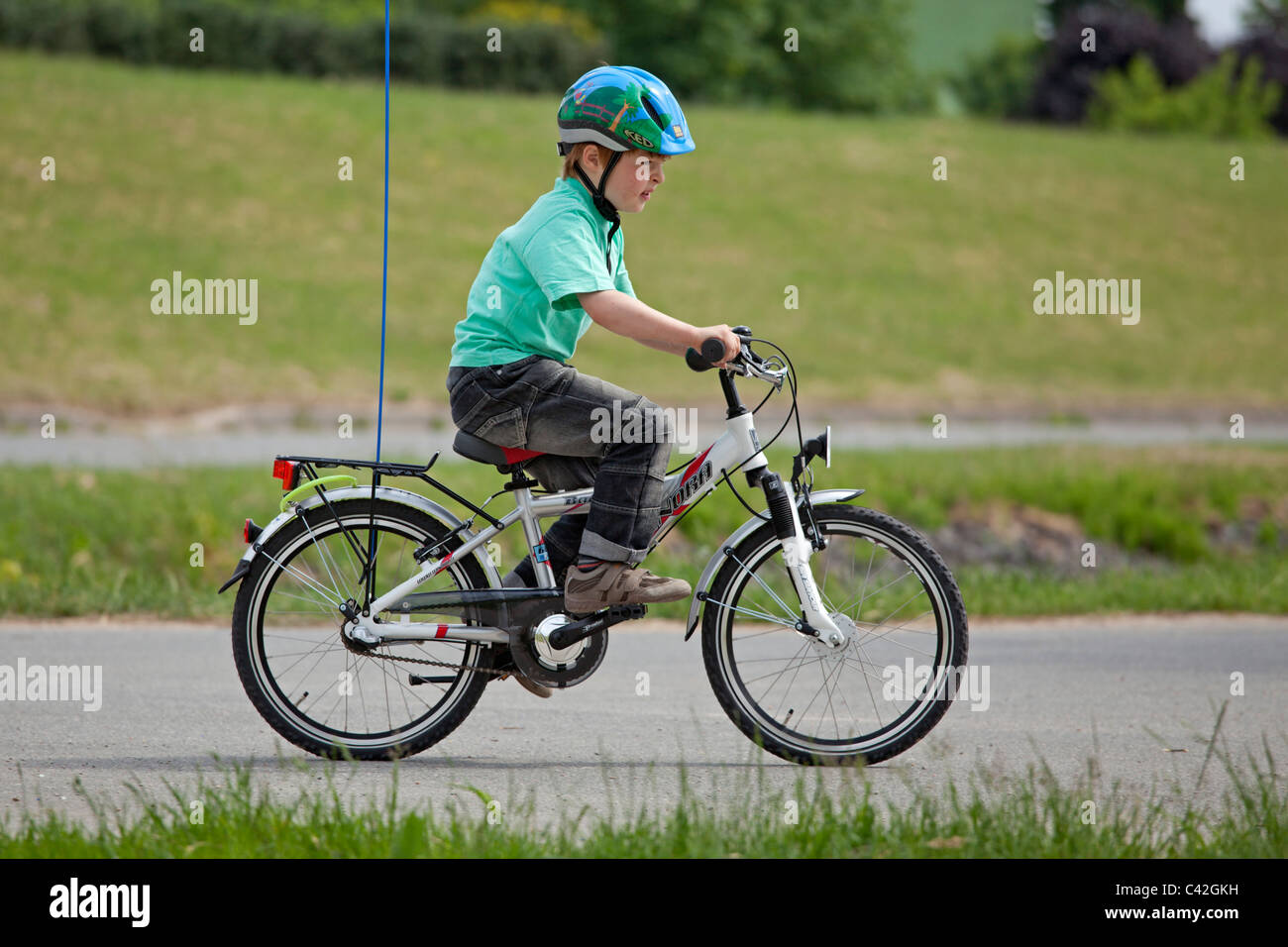 young boy cycling Stock Photo - Alamy