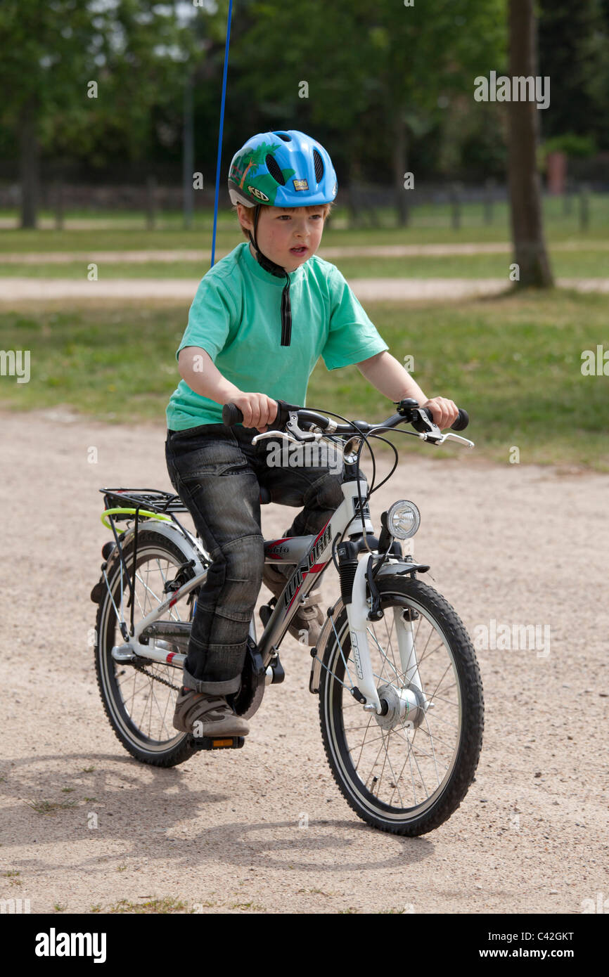 young boy cycling Stock Photo - Alamy