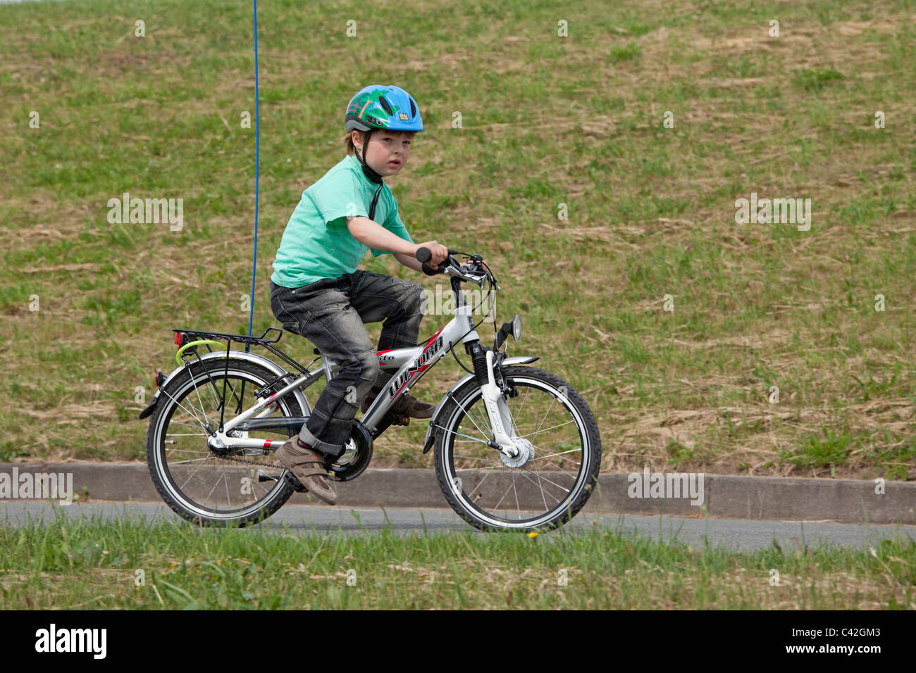 young boy cycling Stock Photo - Alamy