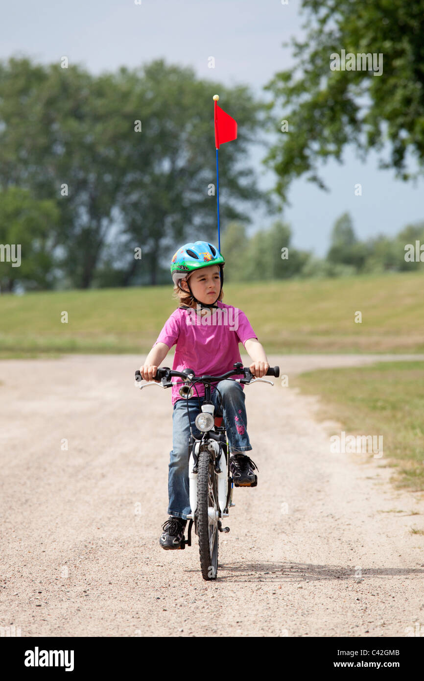 young girl cycling Stock Photo - Alamy