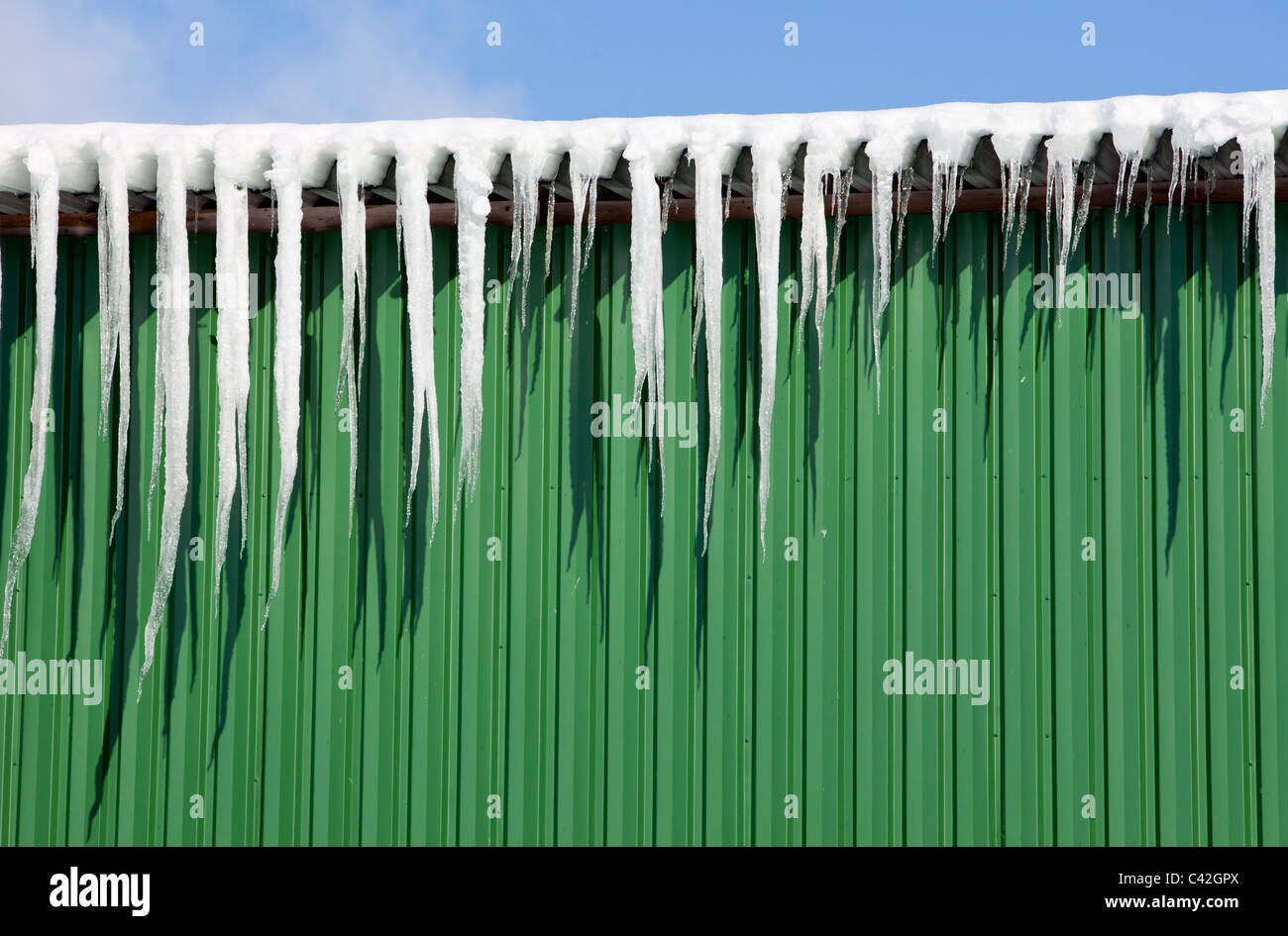 Icicles and green wall , Finland Stock Photo - Alamy
